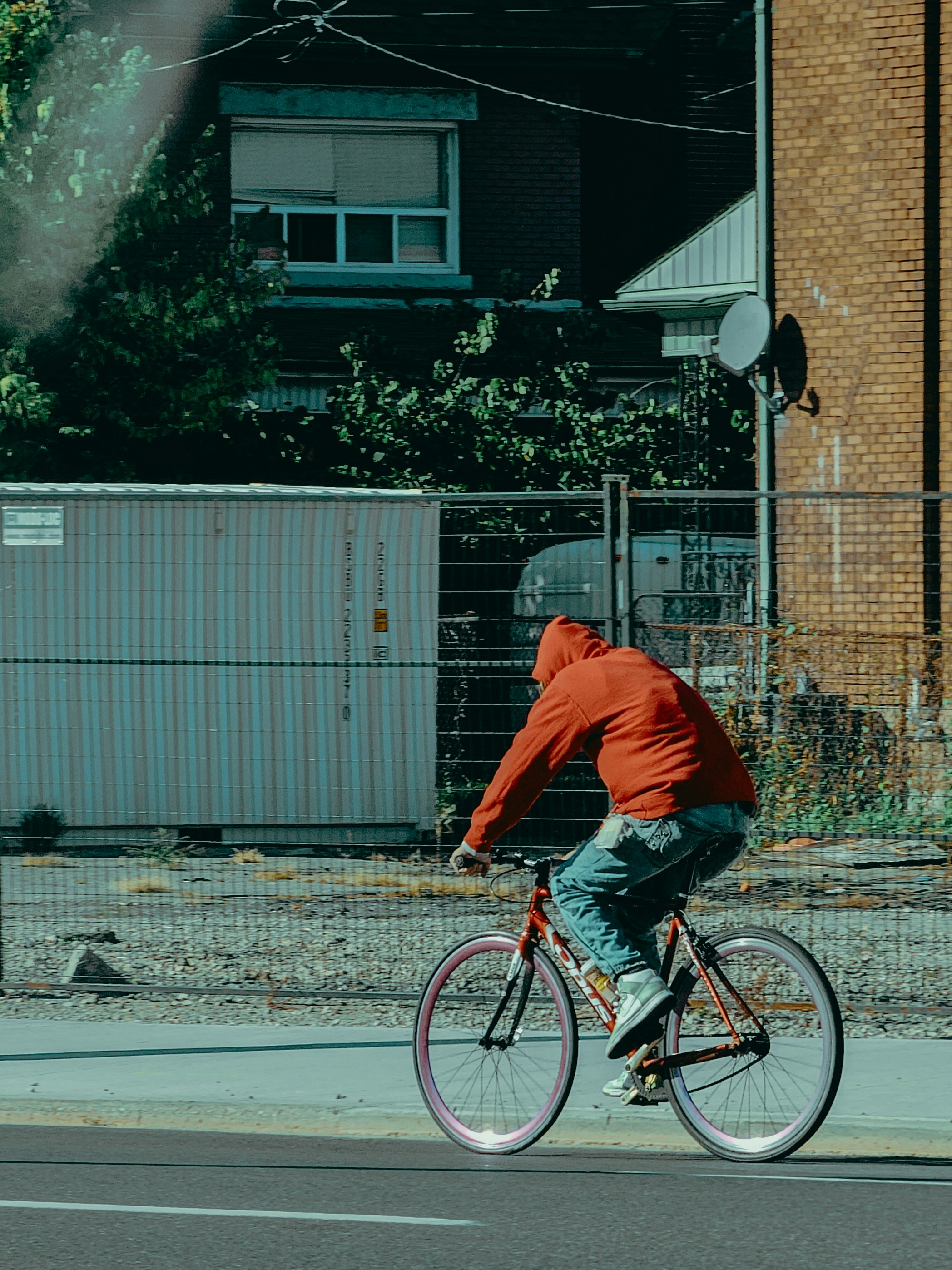 Red Hoodie Gambit: A City Ride Through Fenced Alleyways