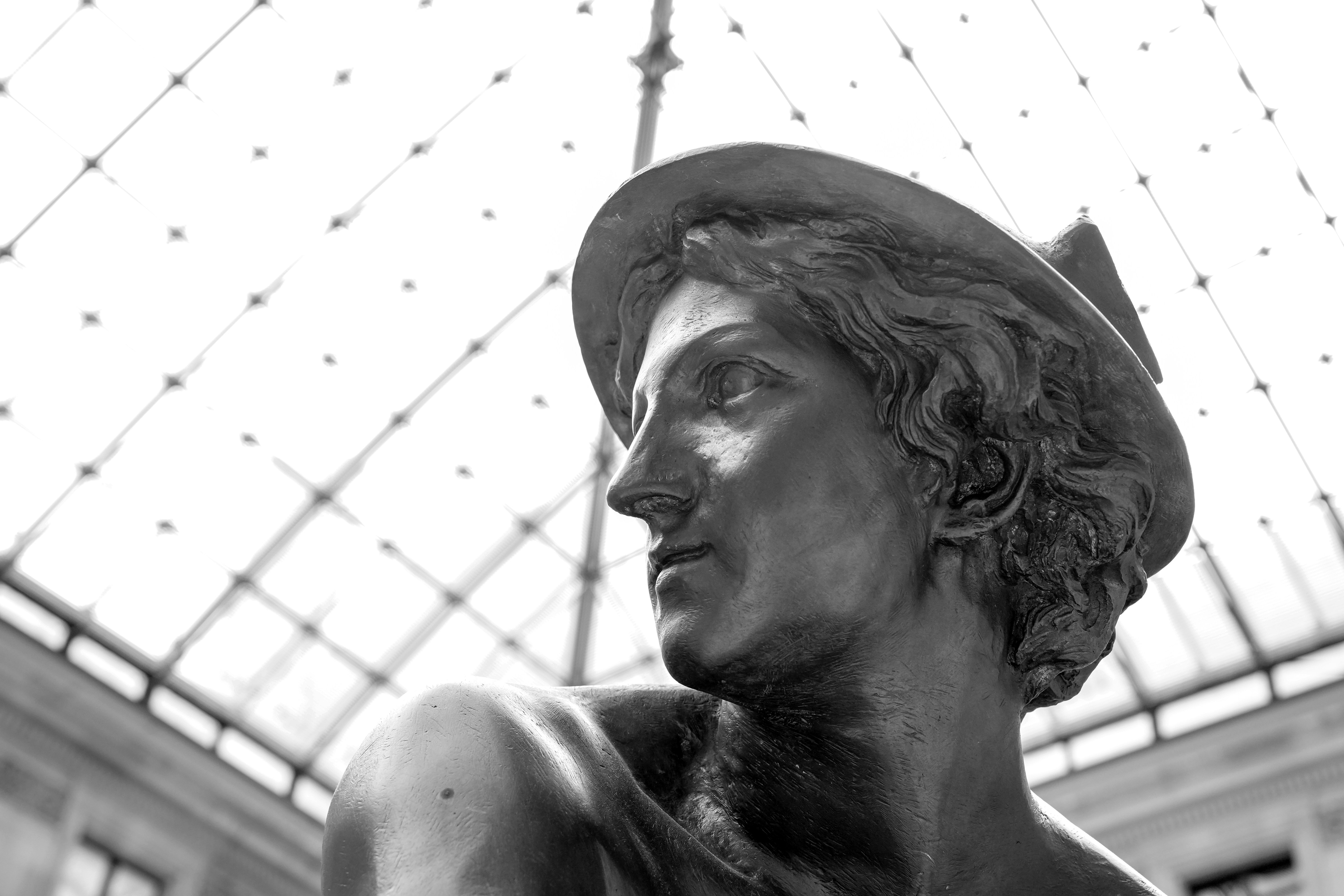 Stone Muse: A Sculpted Portrait Under Glass