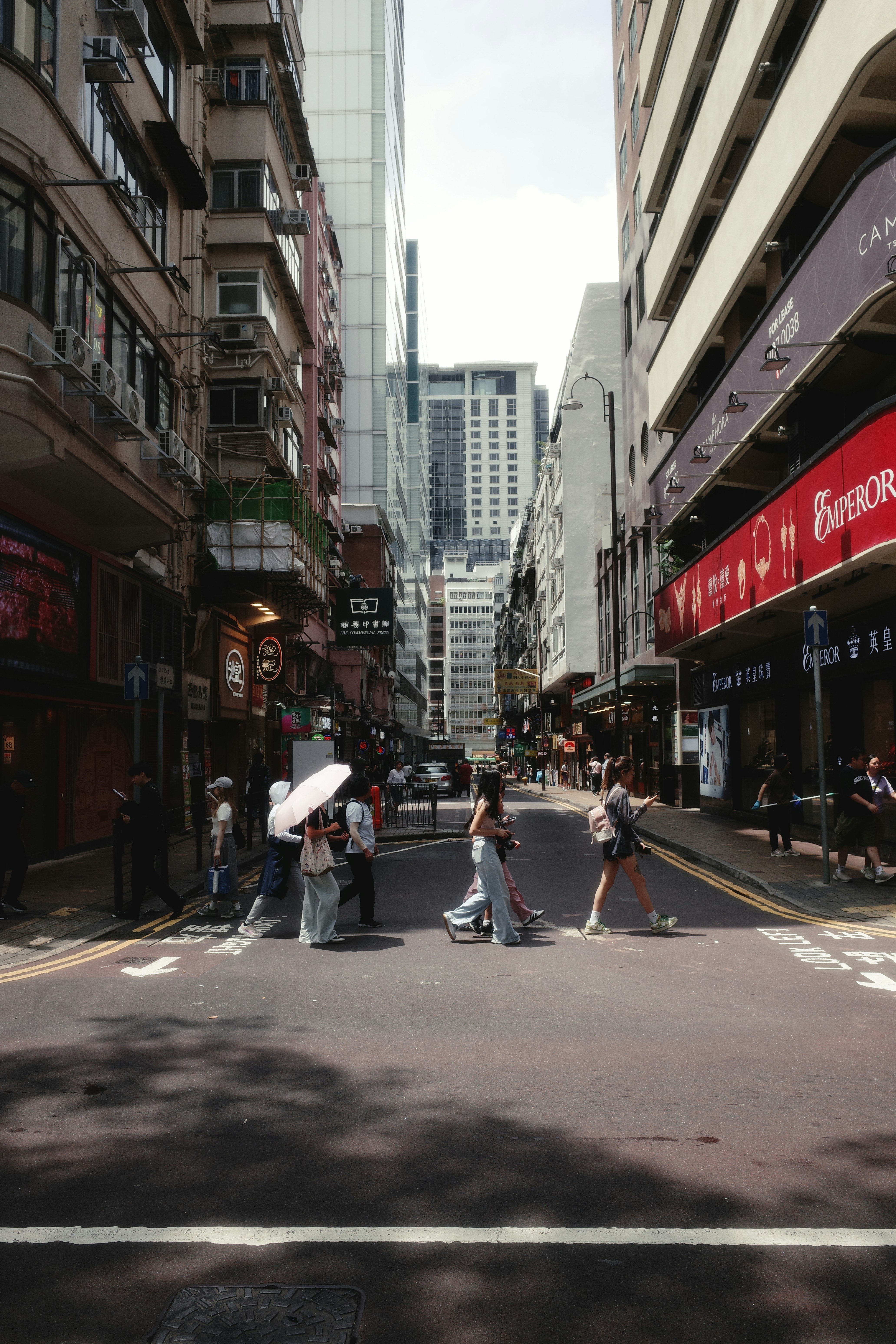 Crosswalk Pulse: Urban Pedestrians in a Sunlit Street