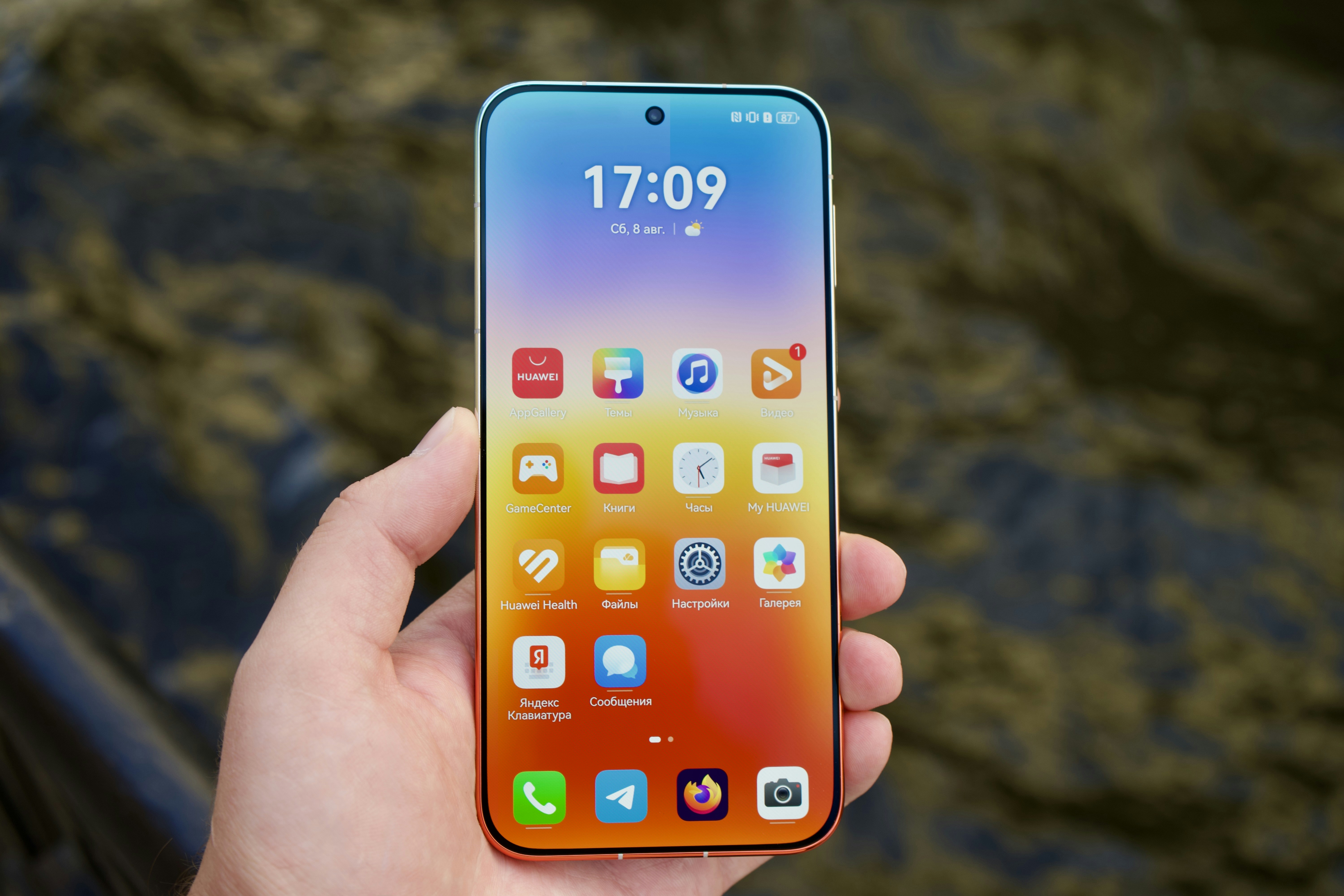 Glow in Hand: A Vibrant Portrait of a Smartphone in Focus