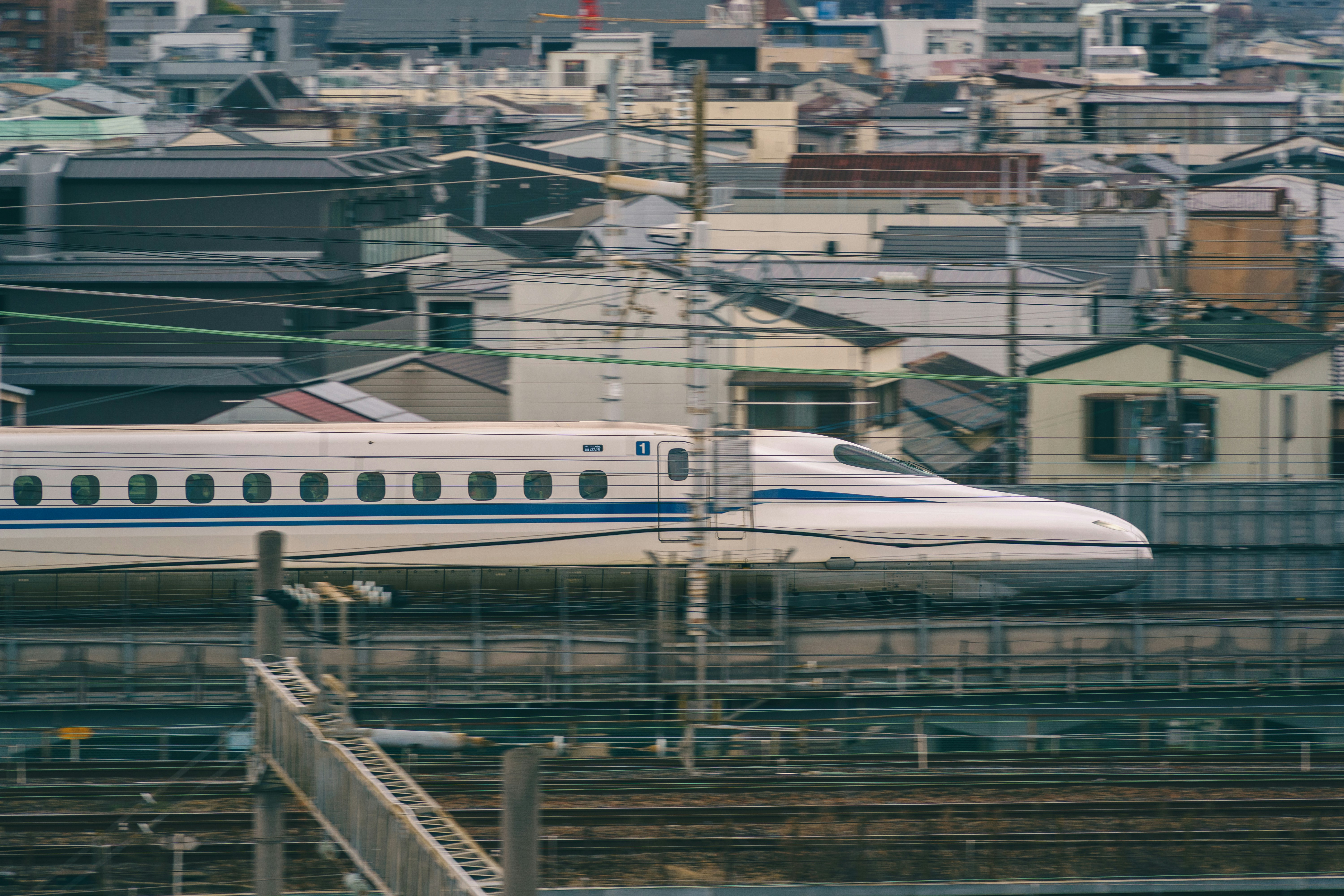 Line of Speed: A Mono-rail Train Slices Through an Urban Spine