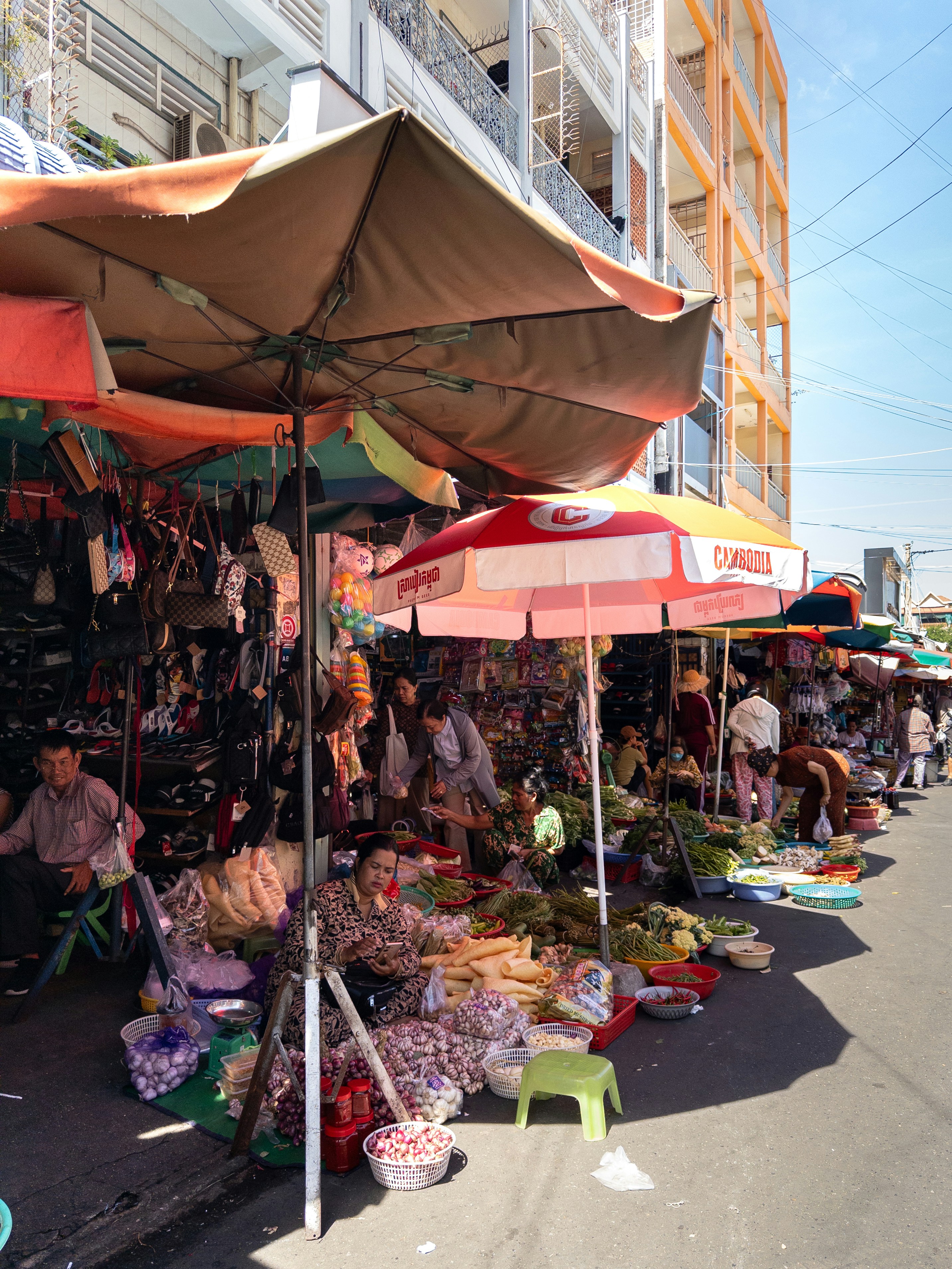 Market Under Colorful Canopies: Fresh Produce and Bustling Trade