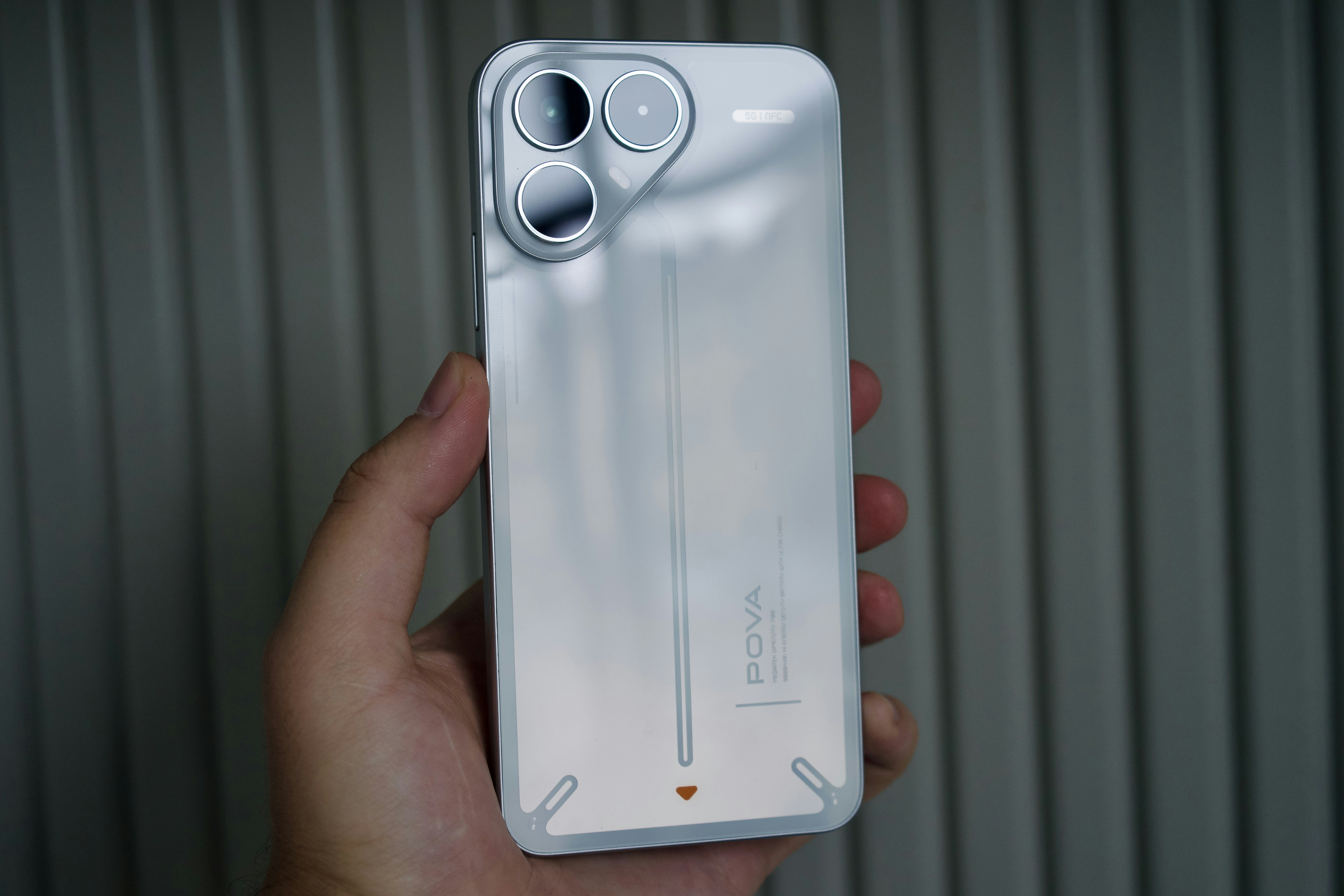 Mirror Back: A Glimpse of the iPhone's Sleek Portrait in Hand