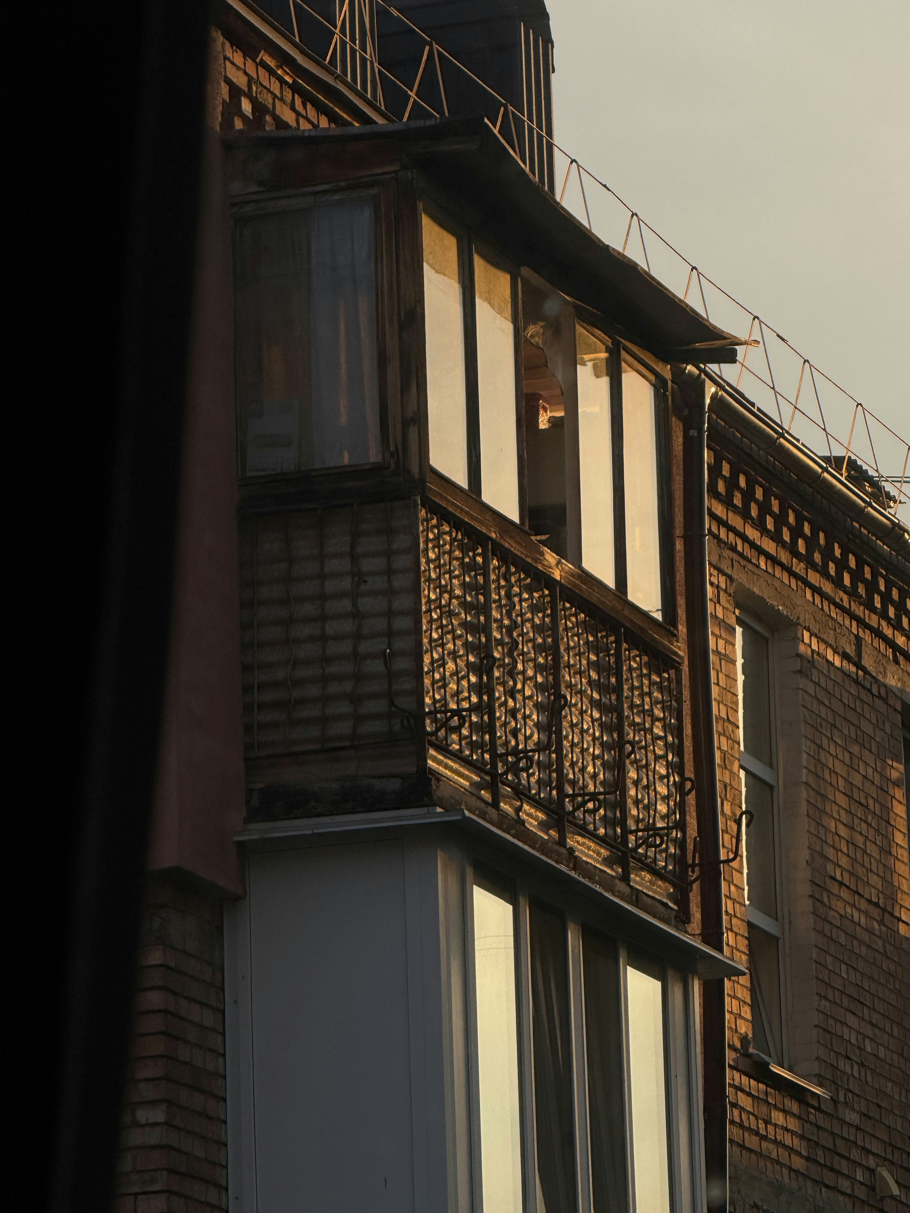 Sunlit Balcony Facade Between Shadows