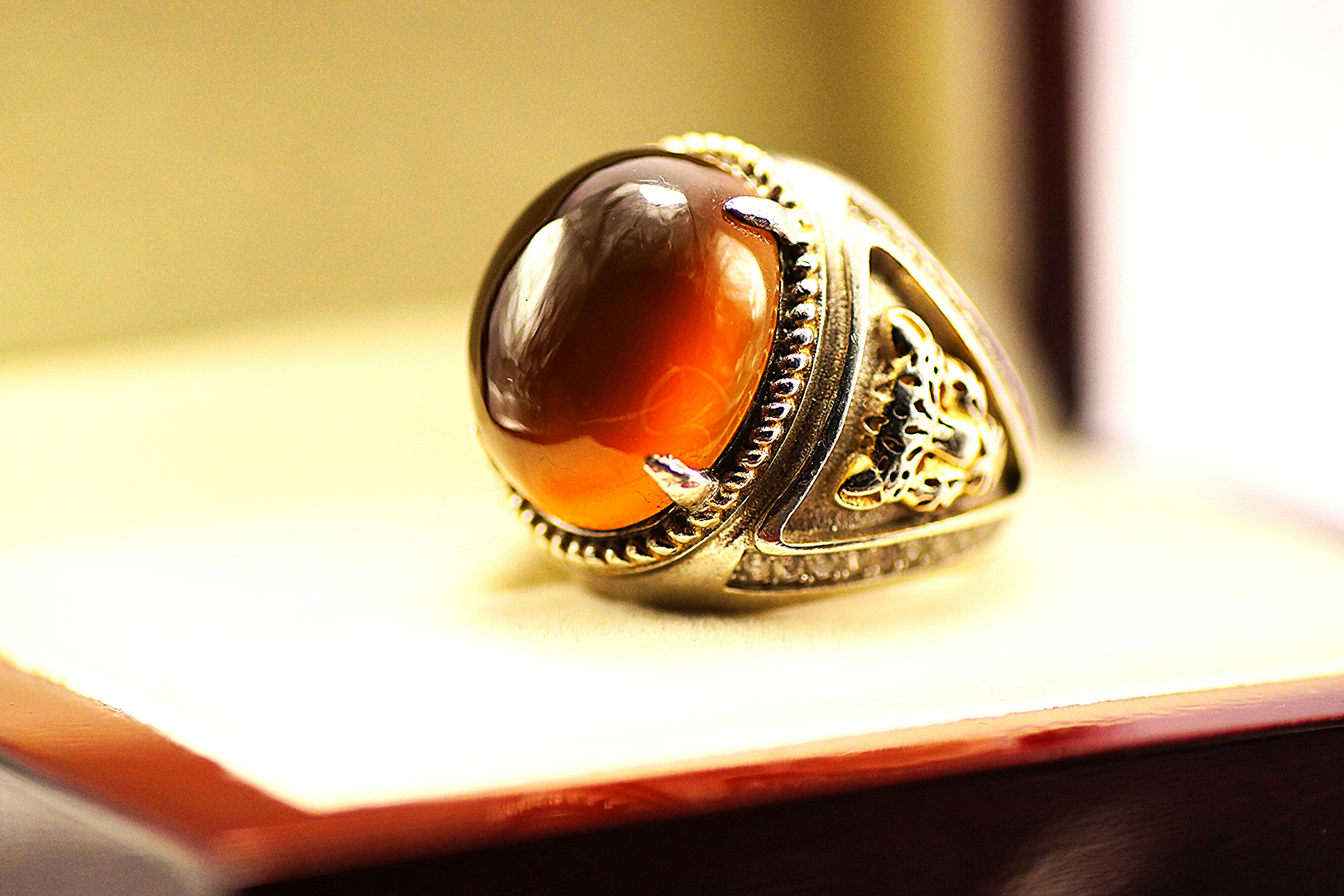 Amber-gemmed Signet on a Warm Surface