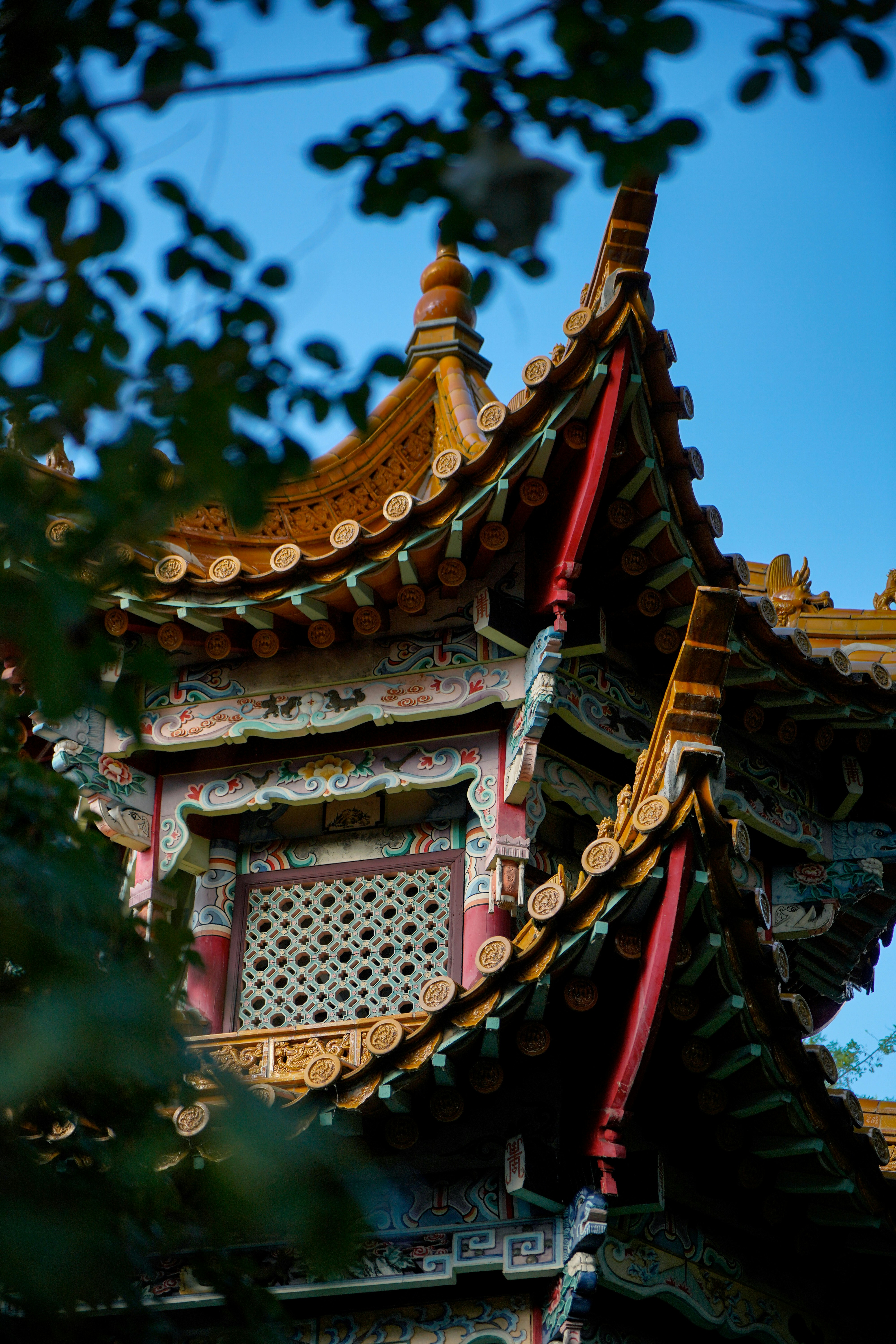 Ornate Rooflines and Painted Beams: A Templescape in Dappled Sun