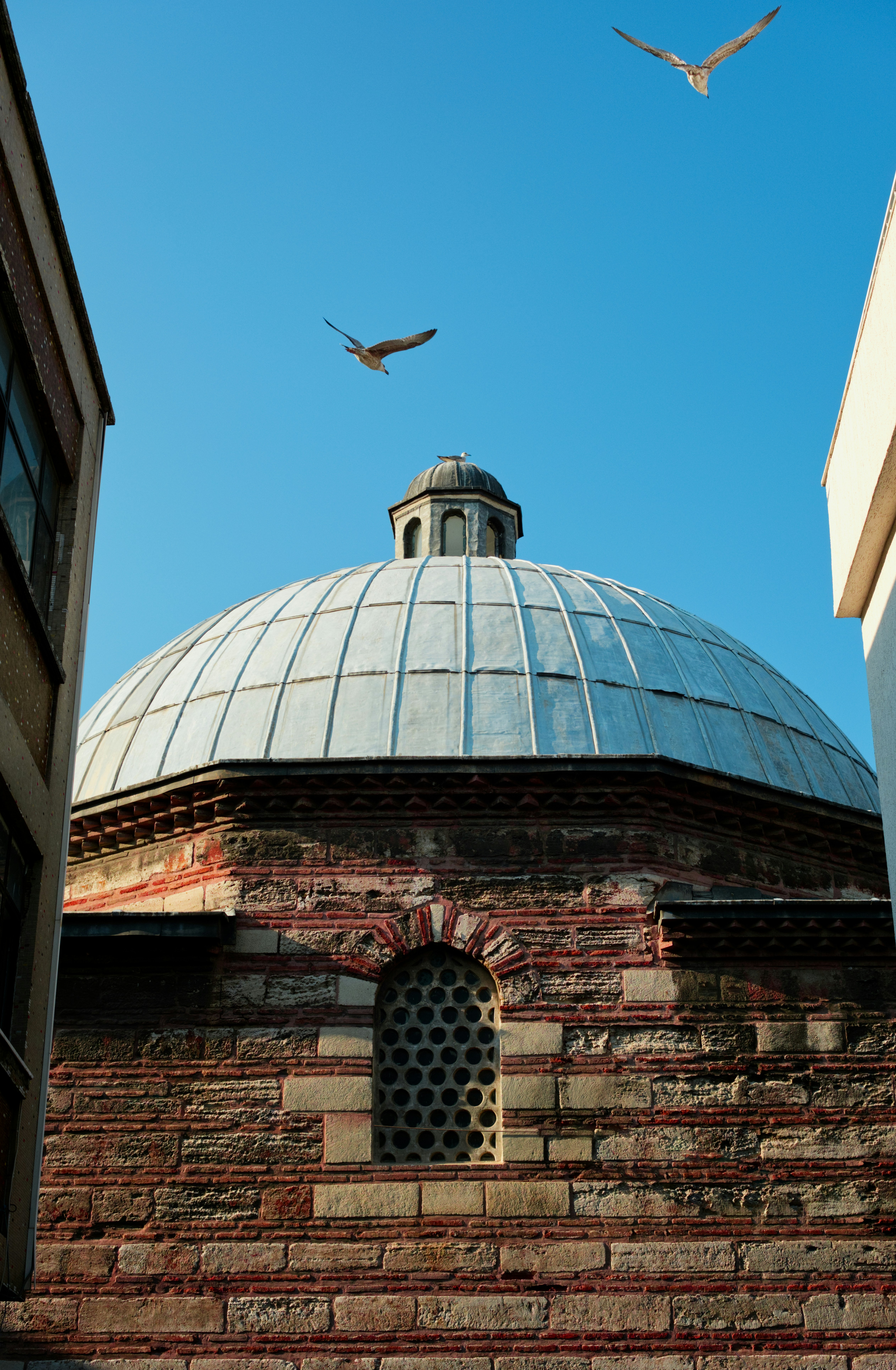 Blue Dome Above Brick Arcades