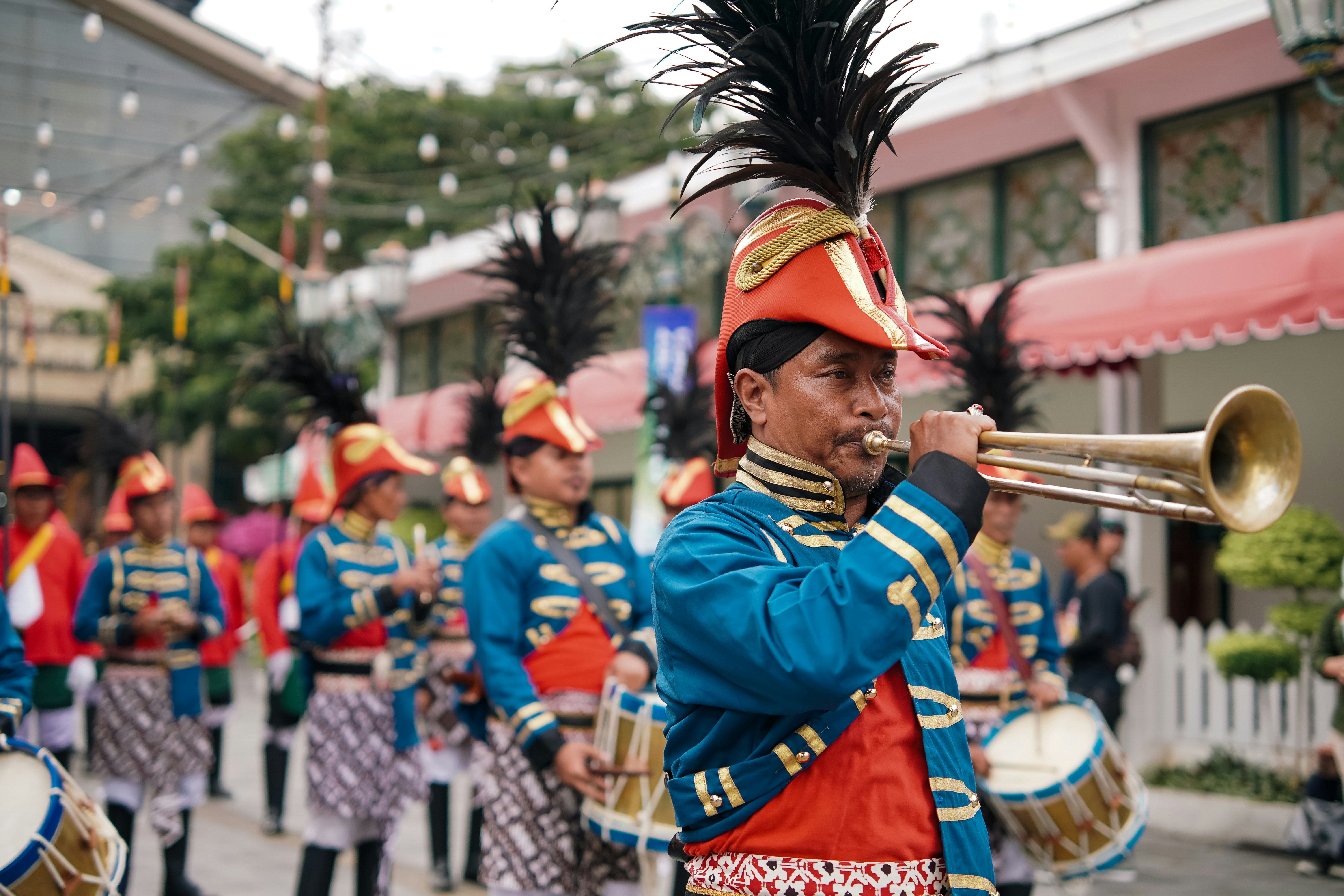 Brass Parade: The Lead Bugler in a Colorful Street Cadence