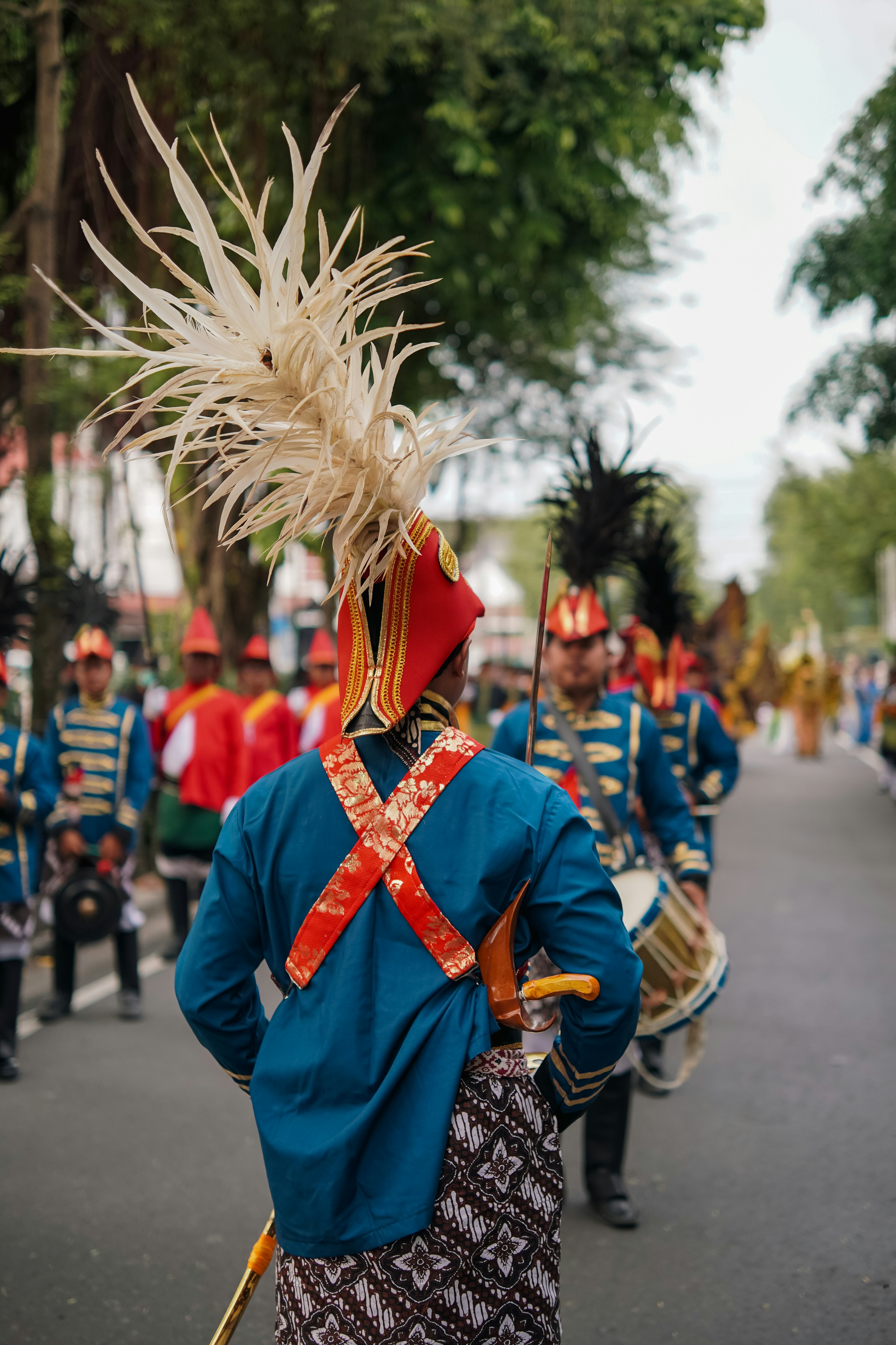 Feathered Spectacle: A Parade Leader in Cerulean Uniforms
