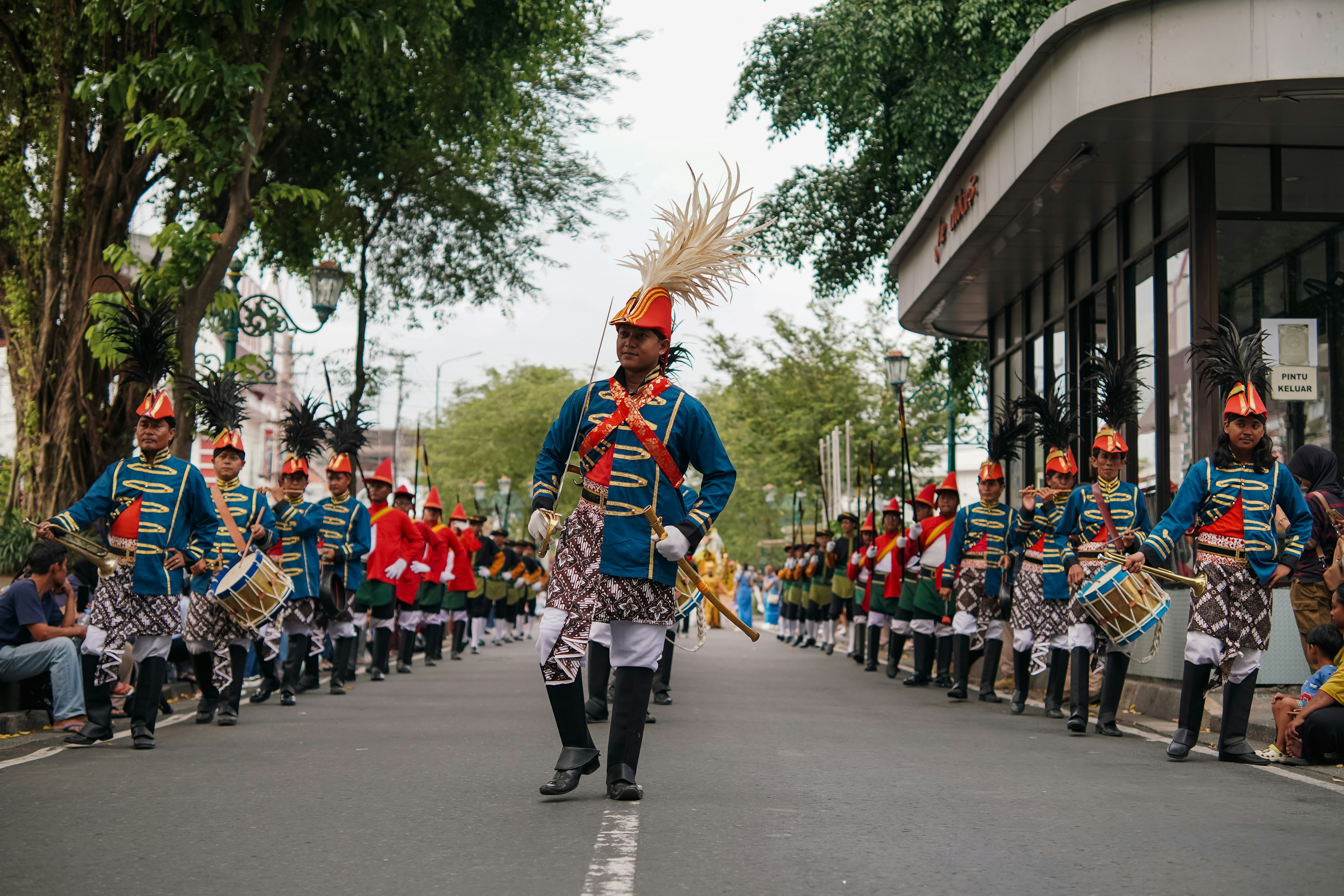 Drumline in the Street: A ceremonial march toward the camera