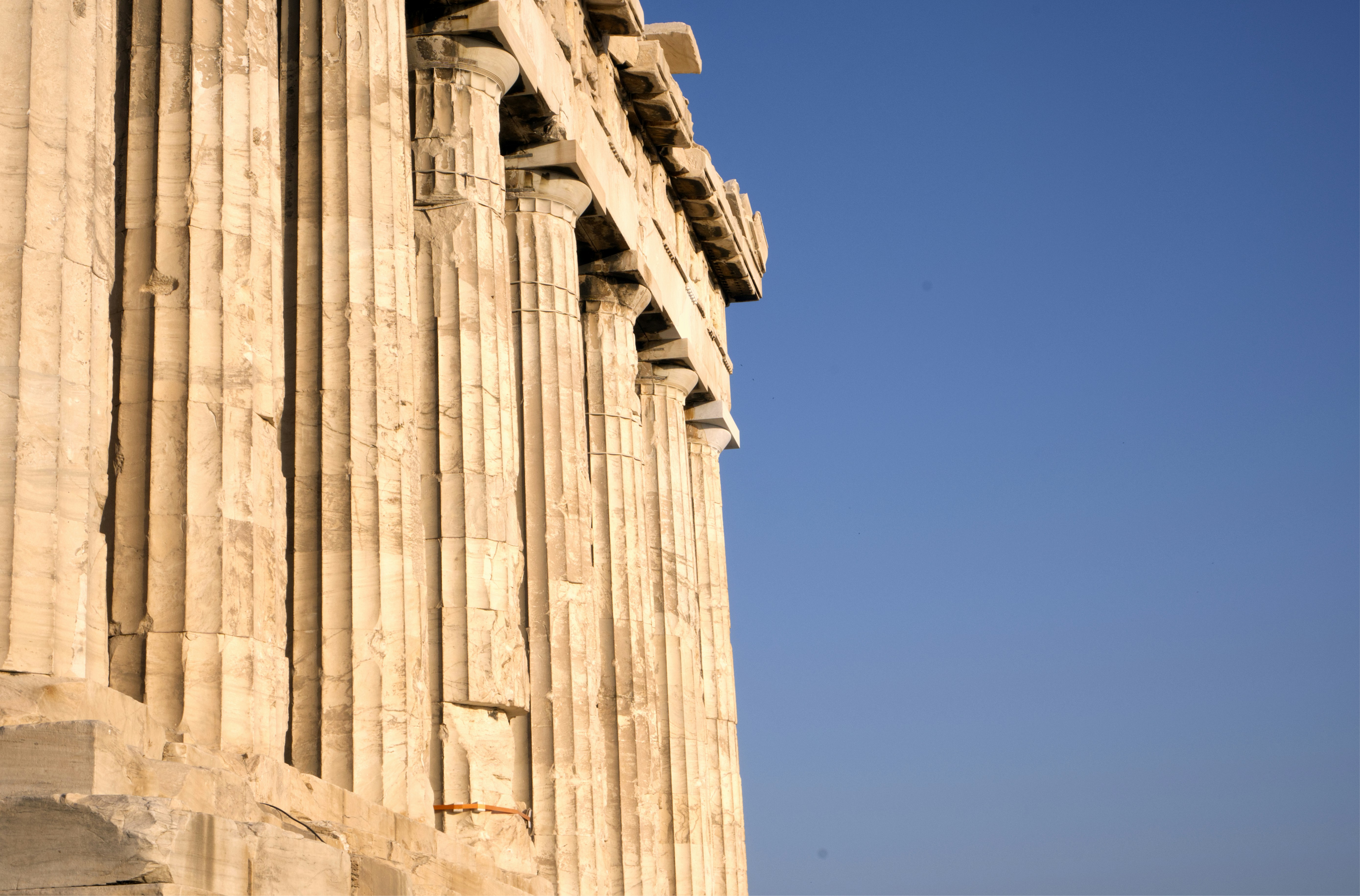Stone Columns Reaching Toward a Clear Sky