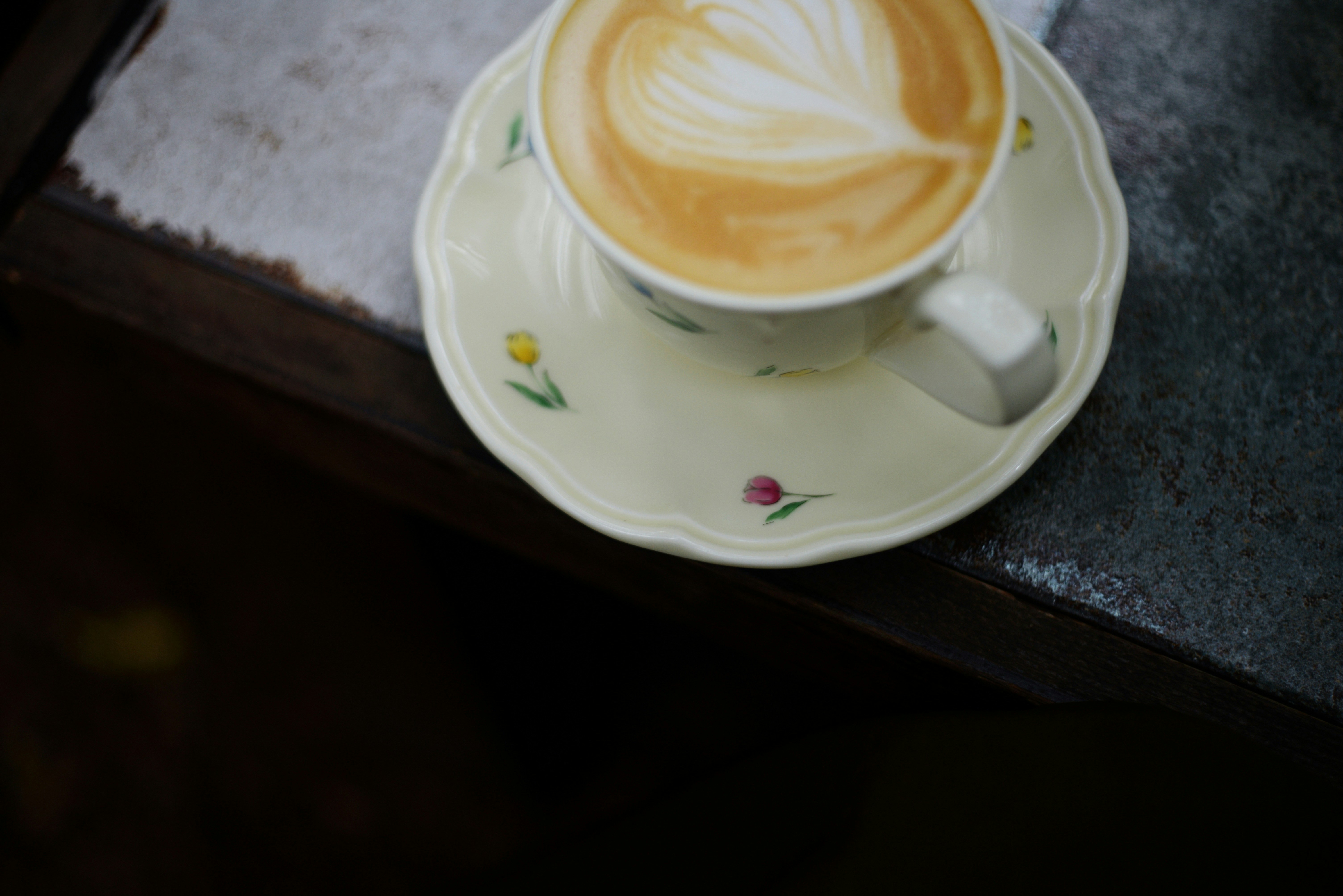 Cup of Stein: A Latte Portrait on a Bare Counter