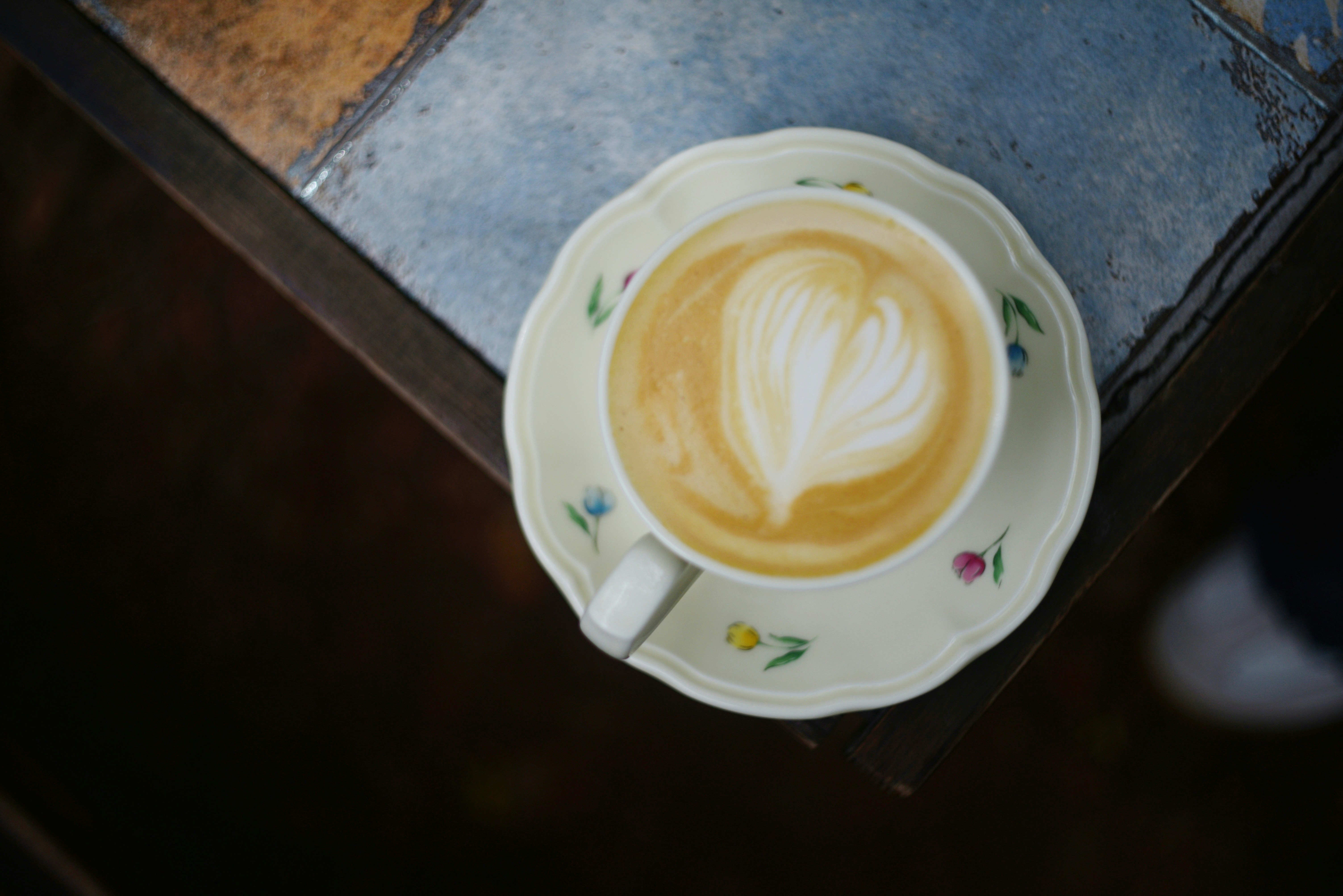 Barista Heart: A Quiet Latte on a Tiled Table