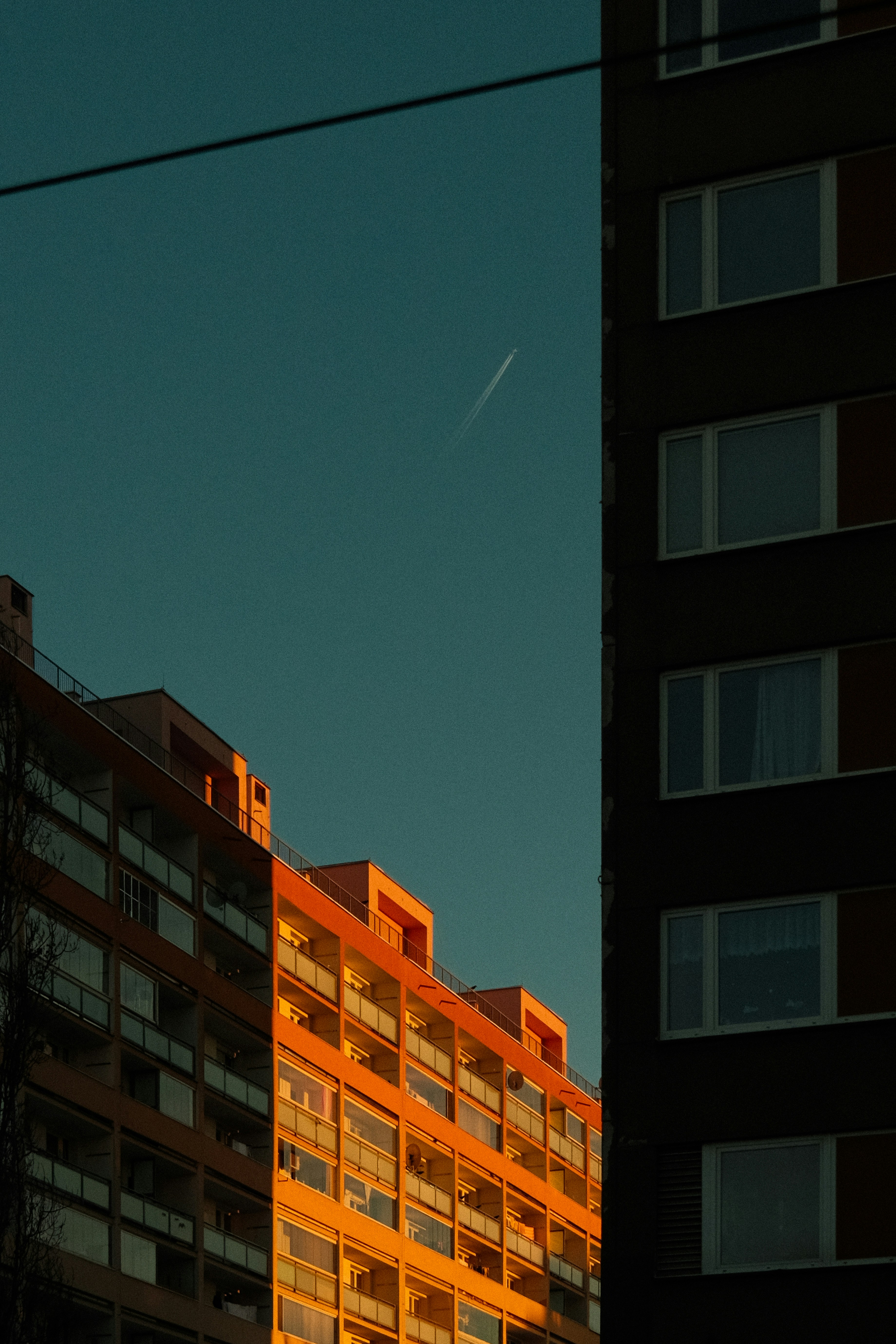 Golden Hour Stairwell: City Blocks in Shade and Sunlight