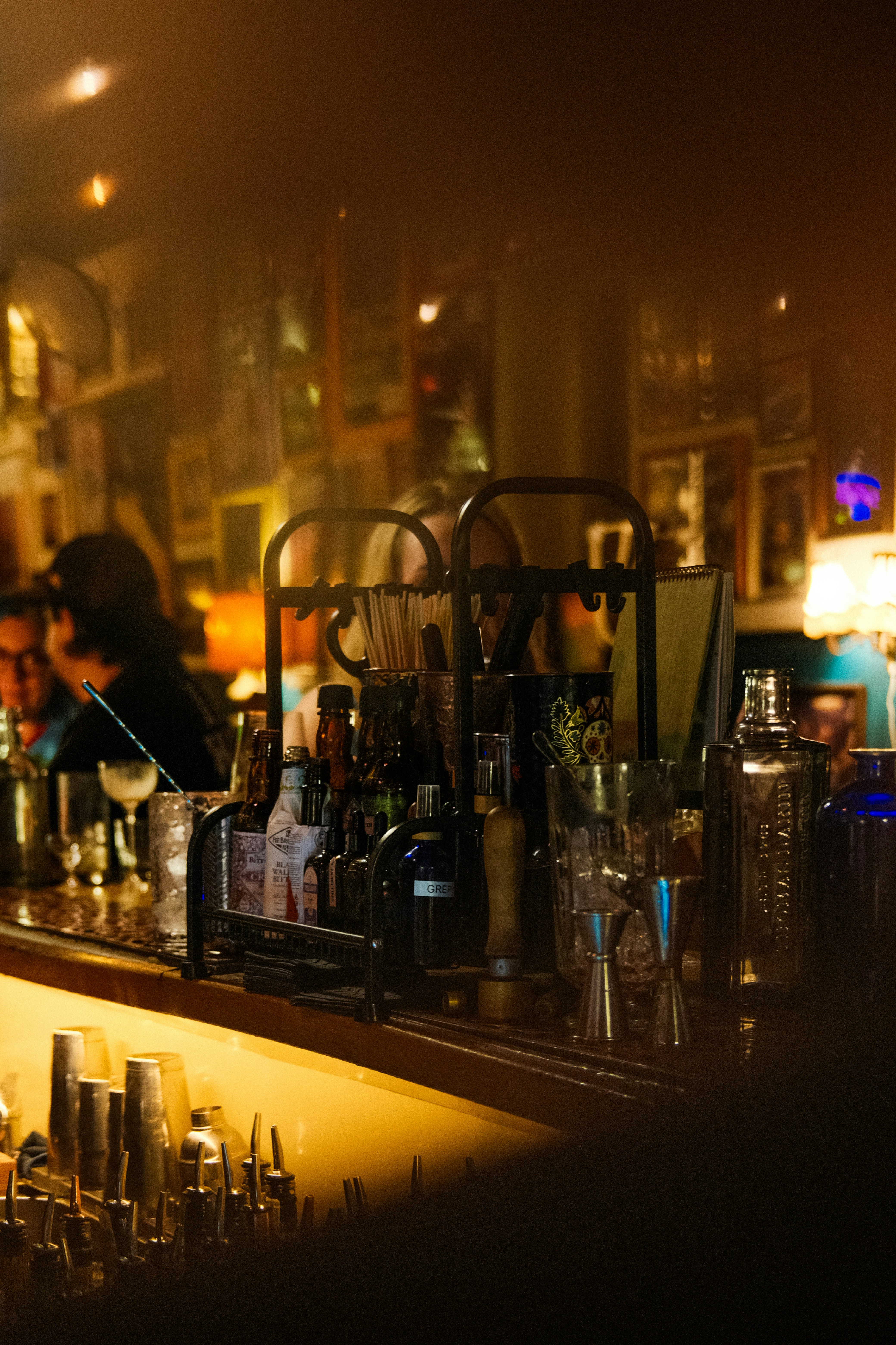 Amber-Glowed Bar Station: Bottles and Mists in a Quiet Night