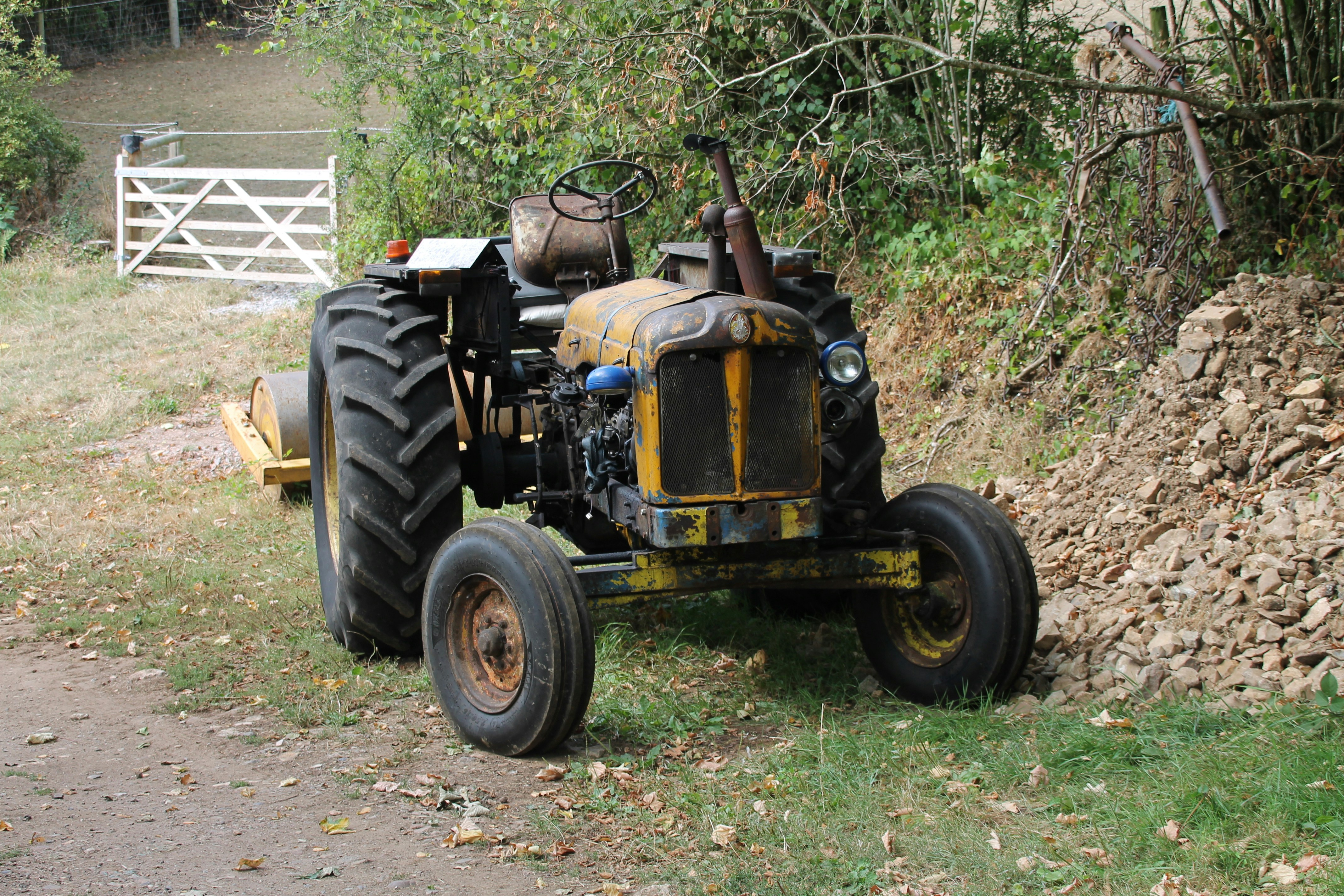 Old Tractor Resting by the Rural Track