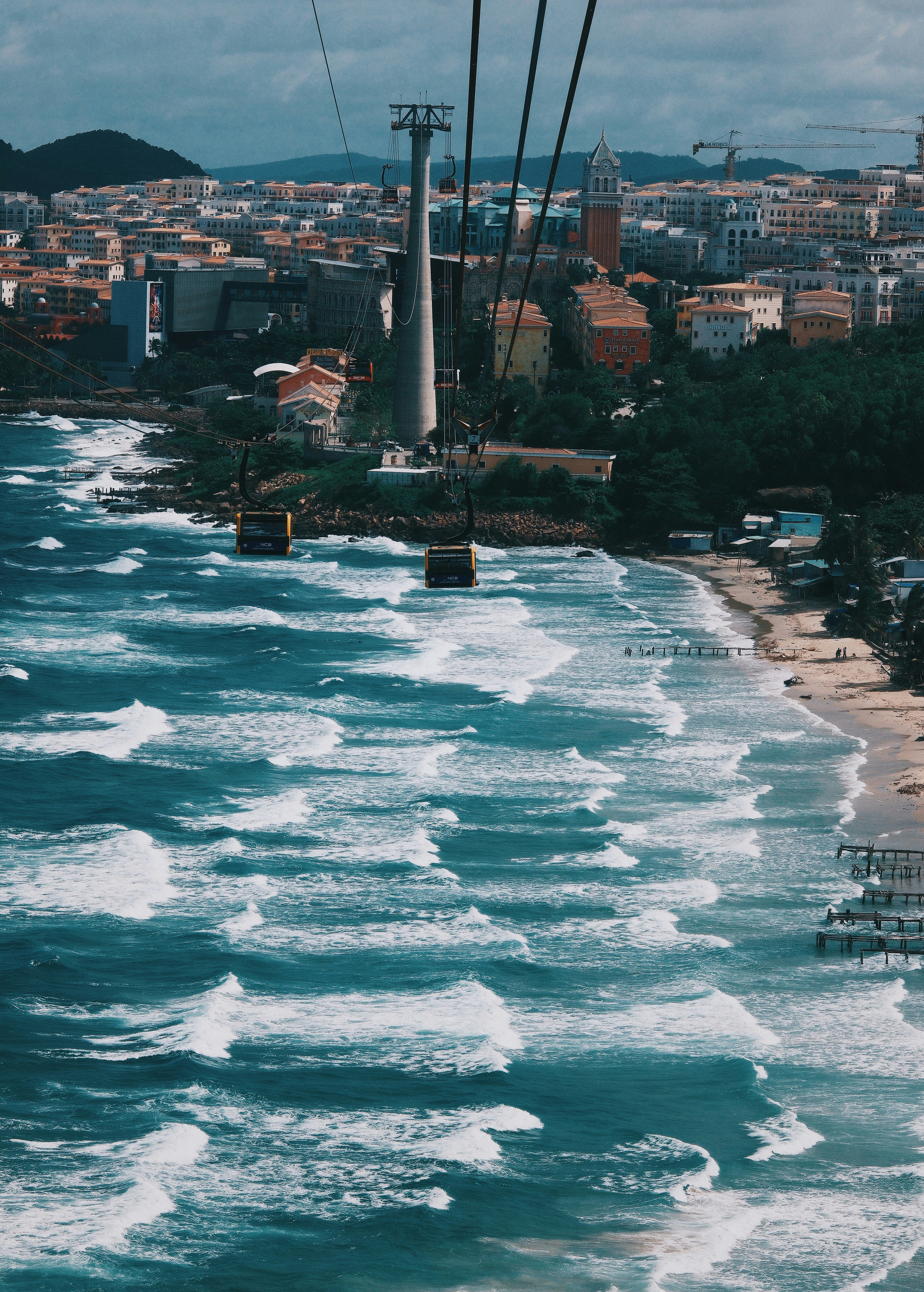 Cablecar Over the Sapphire Coast: A Panoramic Coastal City Scene