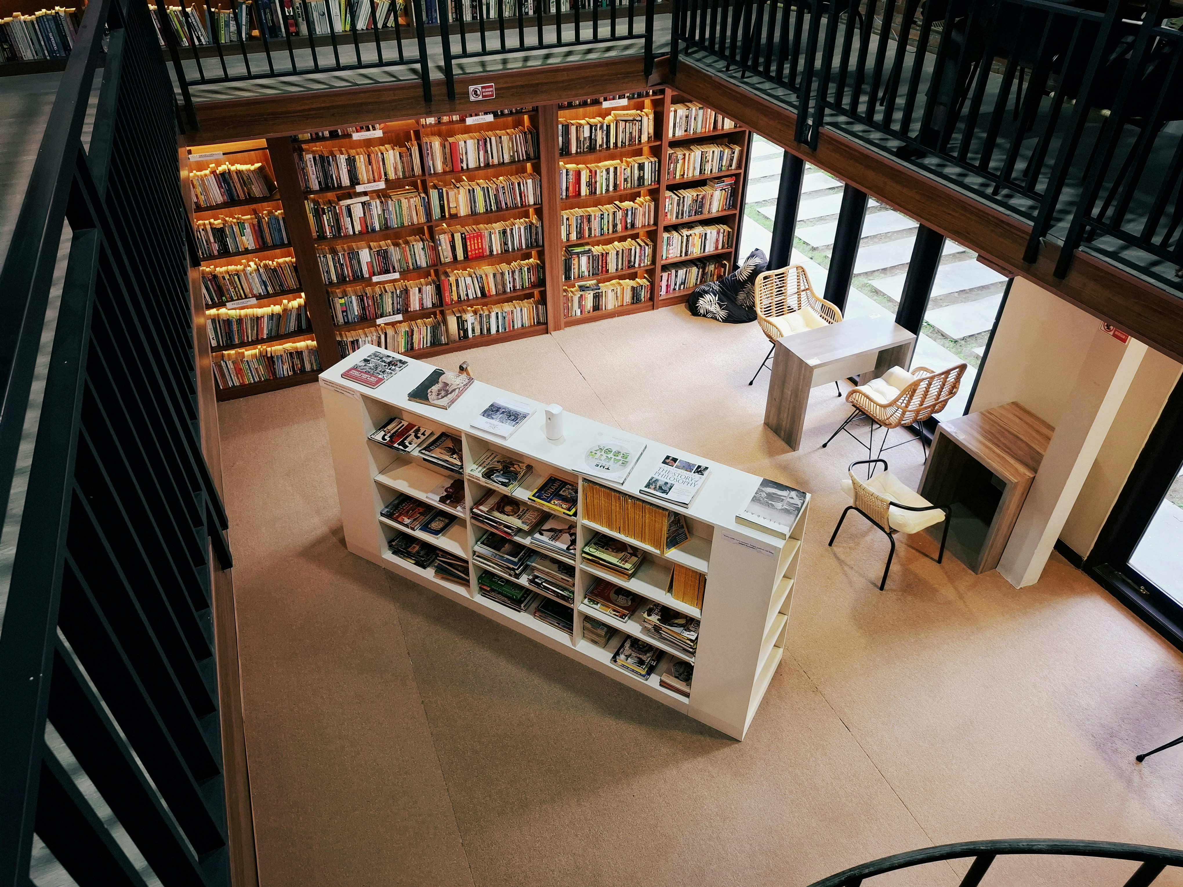 A Quiet Aisle: Central Library Desk Surrounded by Shelves