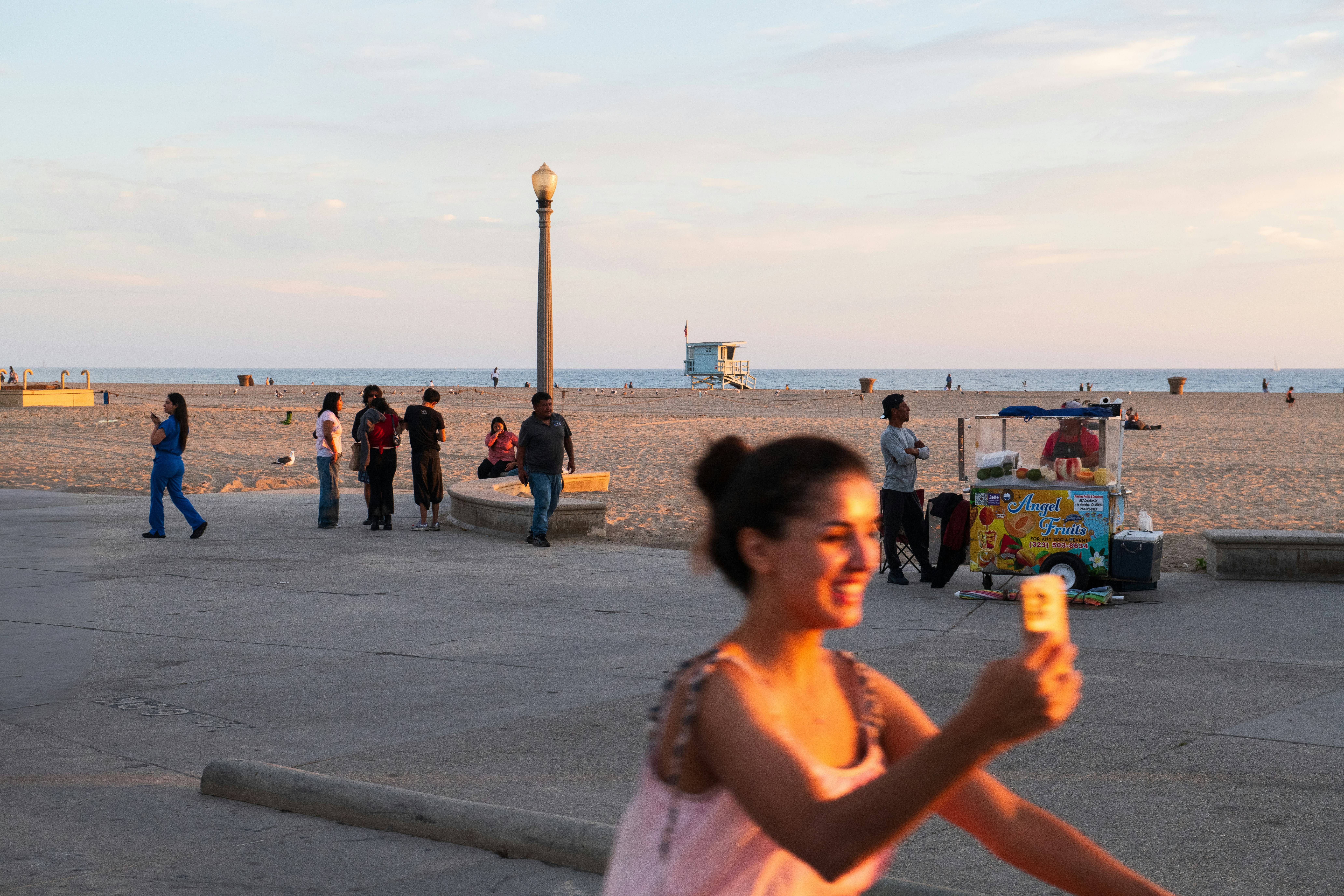 Sunlit selfie on the boardwalk: a blurred smile in motion