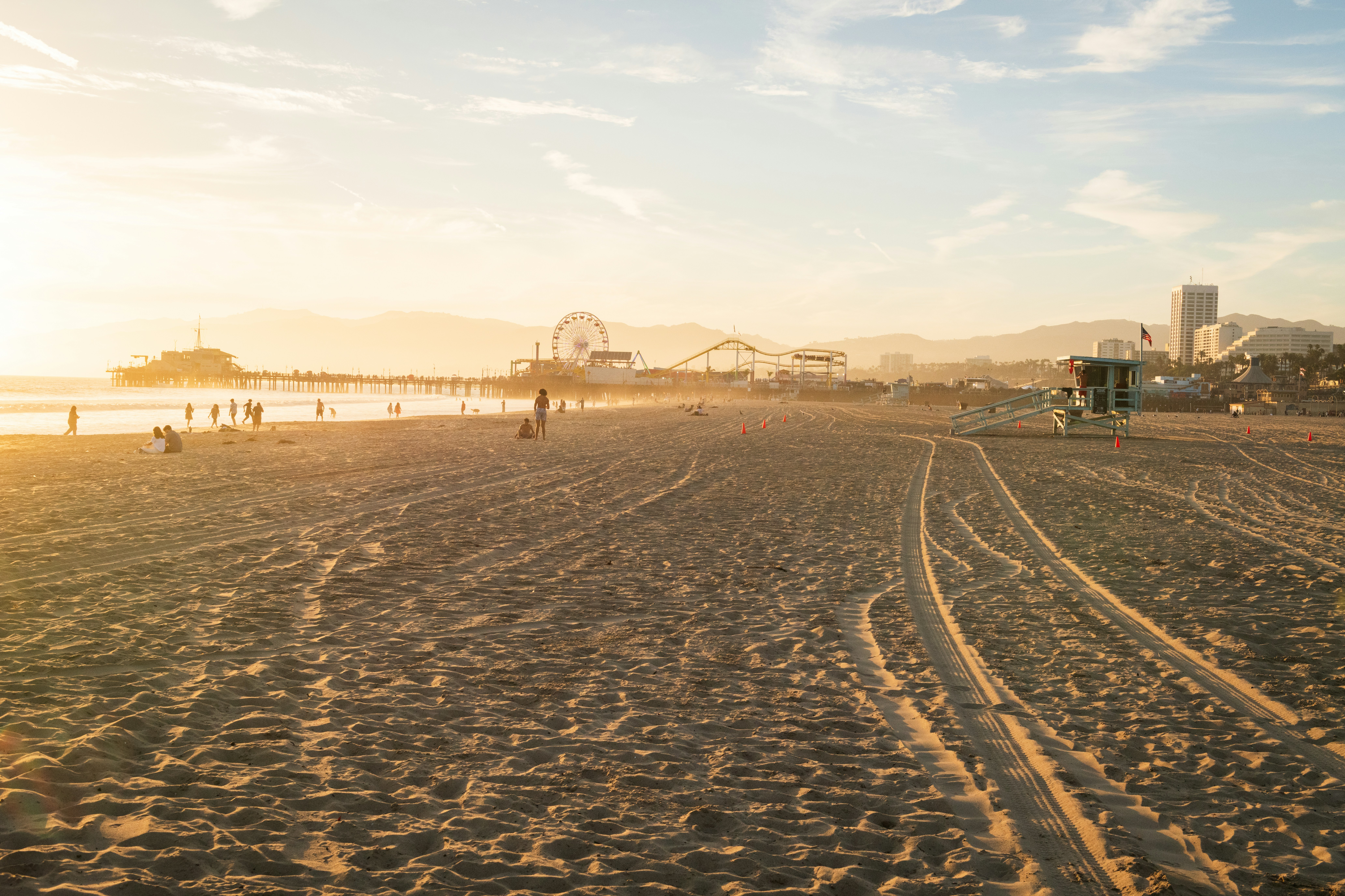 Gilded Shoreline: Sunset Tracks on a Quiet Santa Monica Beach