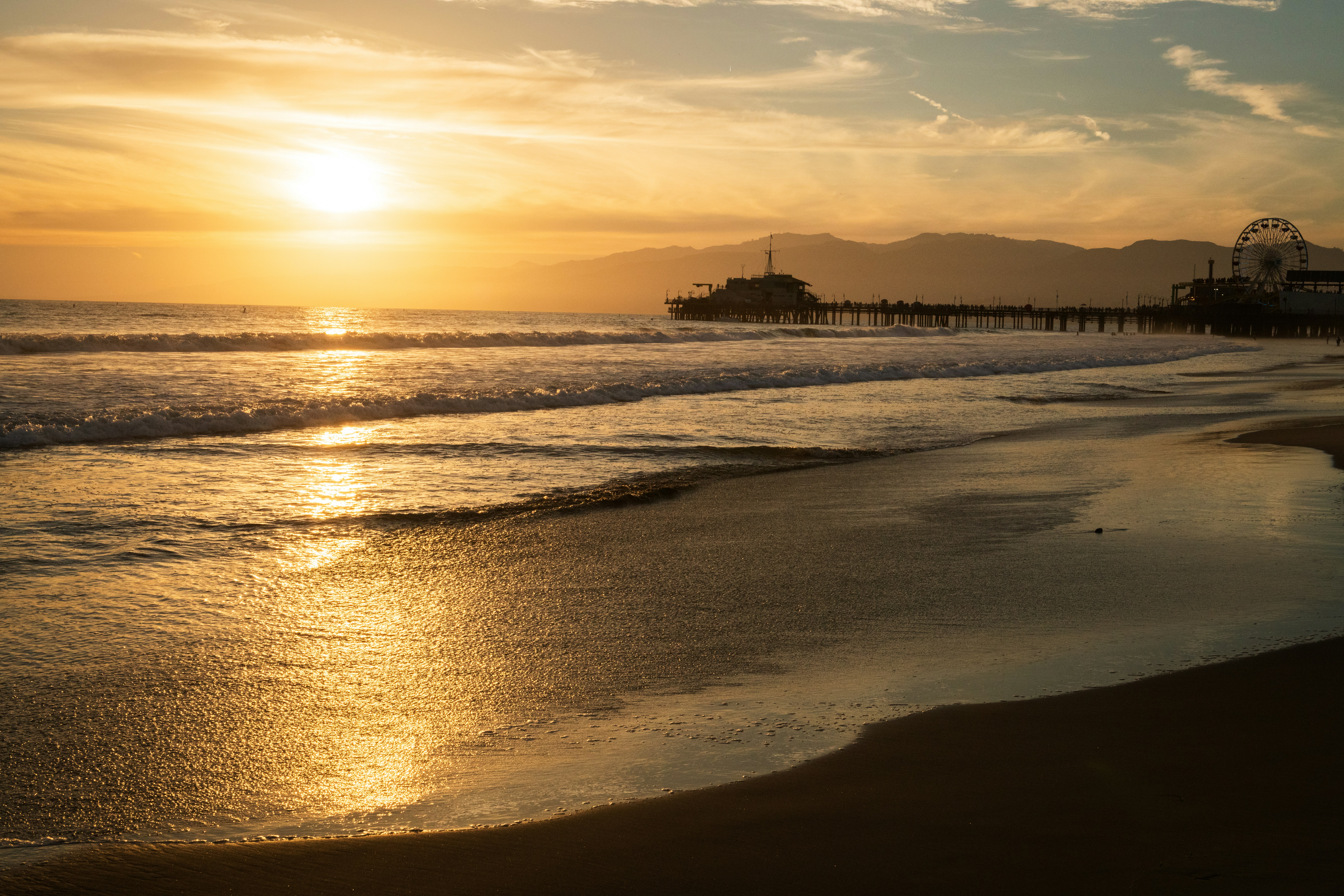 Sunlit Pier at Dusk: A Quiet Evening Over the Pacific