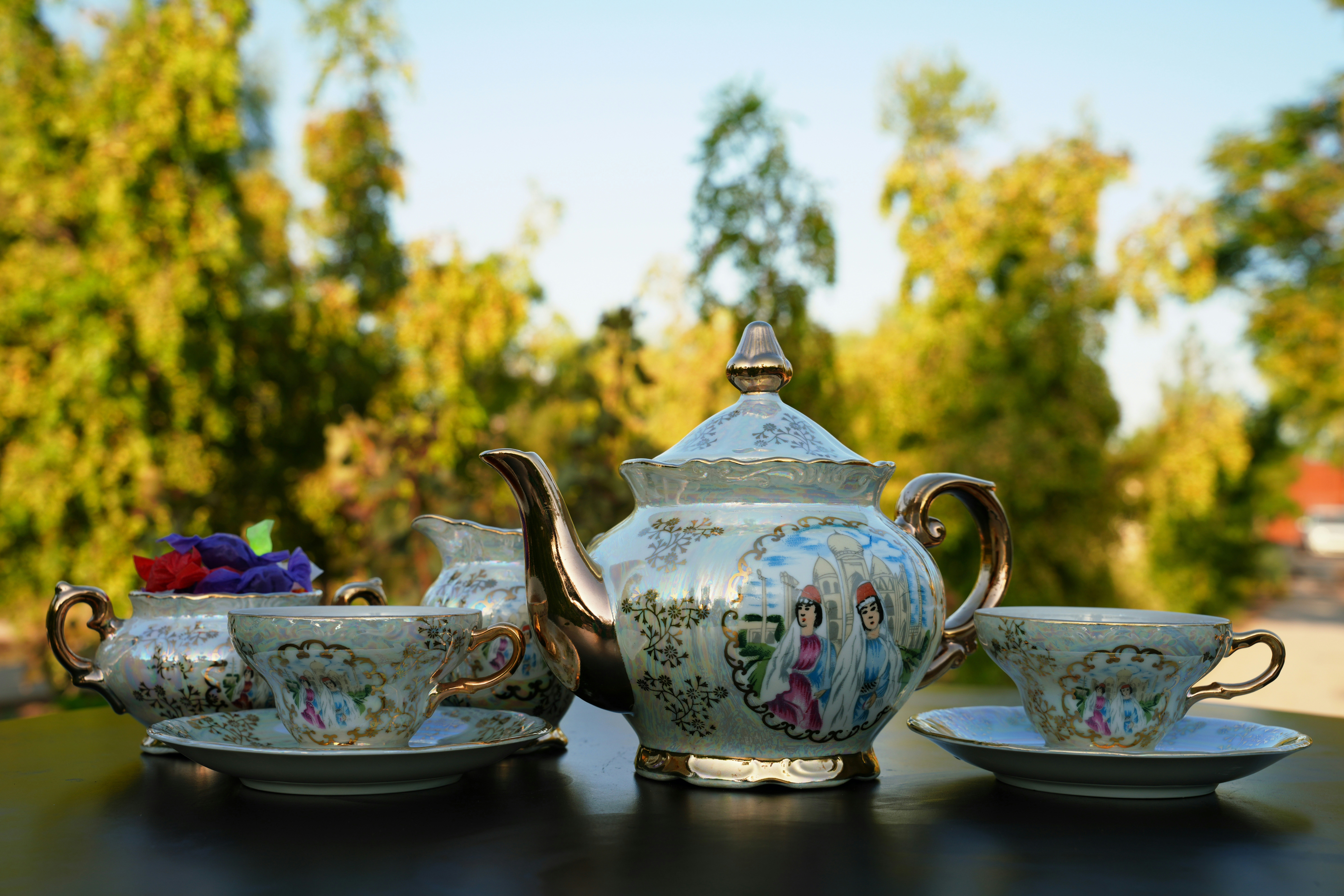 Porcelain Teapot Ensemble on a Sunlit Table