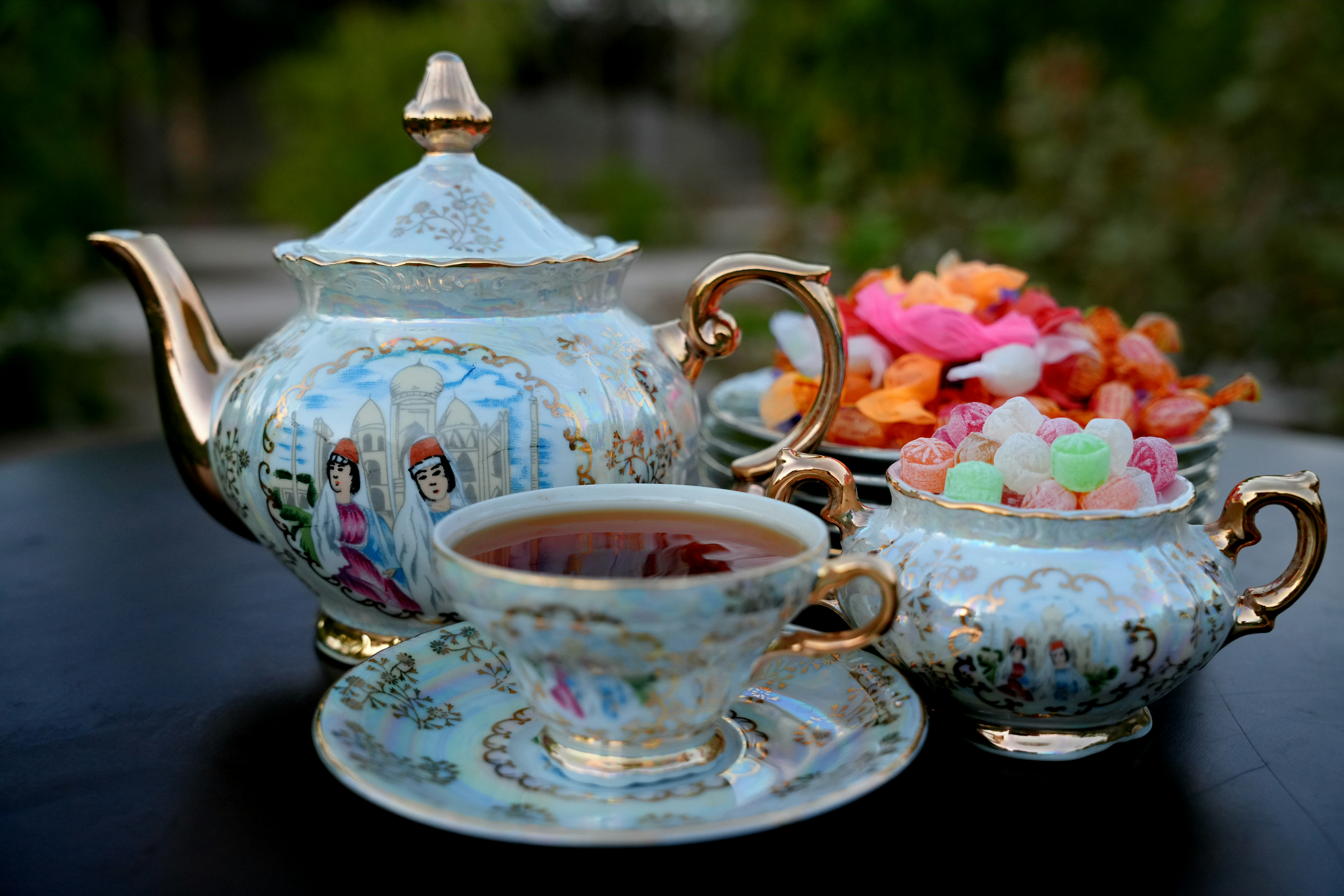 Porcelain Tea Set in Mist: A Close-Up of Delicate Patterns and Treats