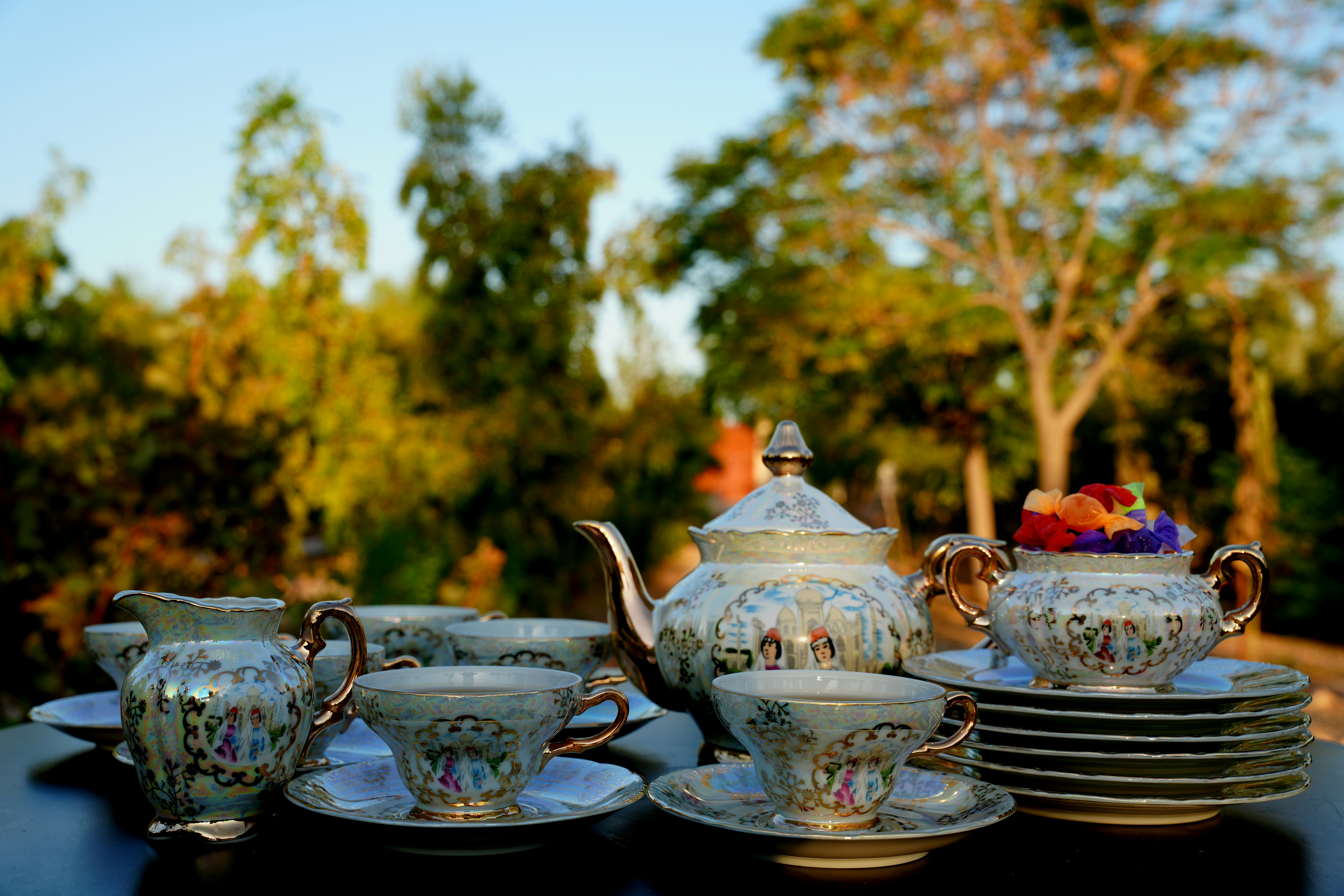 Tea Service in Focus: Fine Porcelain on a Sunset Terrace