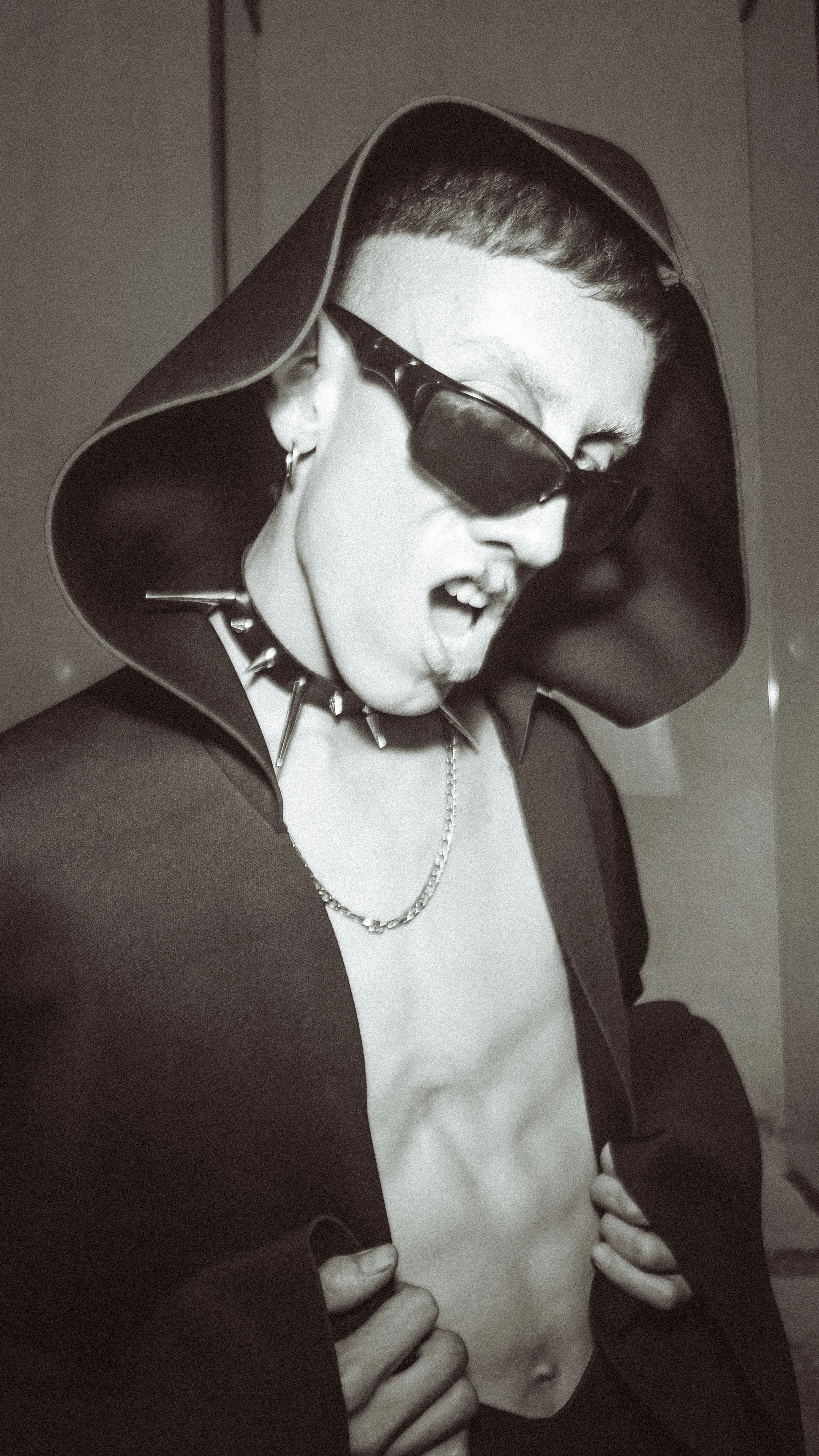 Midnight Rebel: A bold, hooded persona with chrome teeth and dark shades