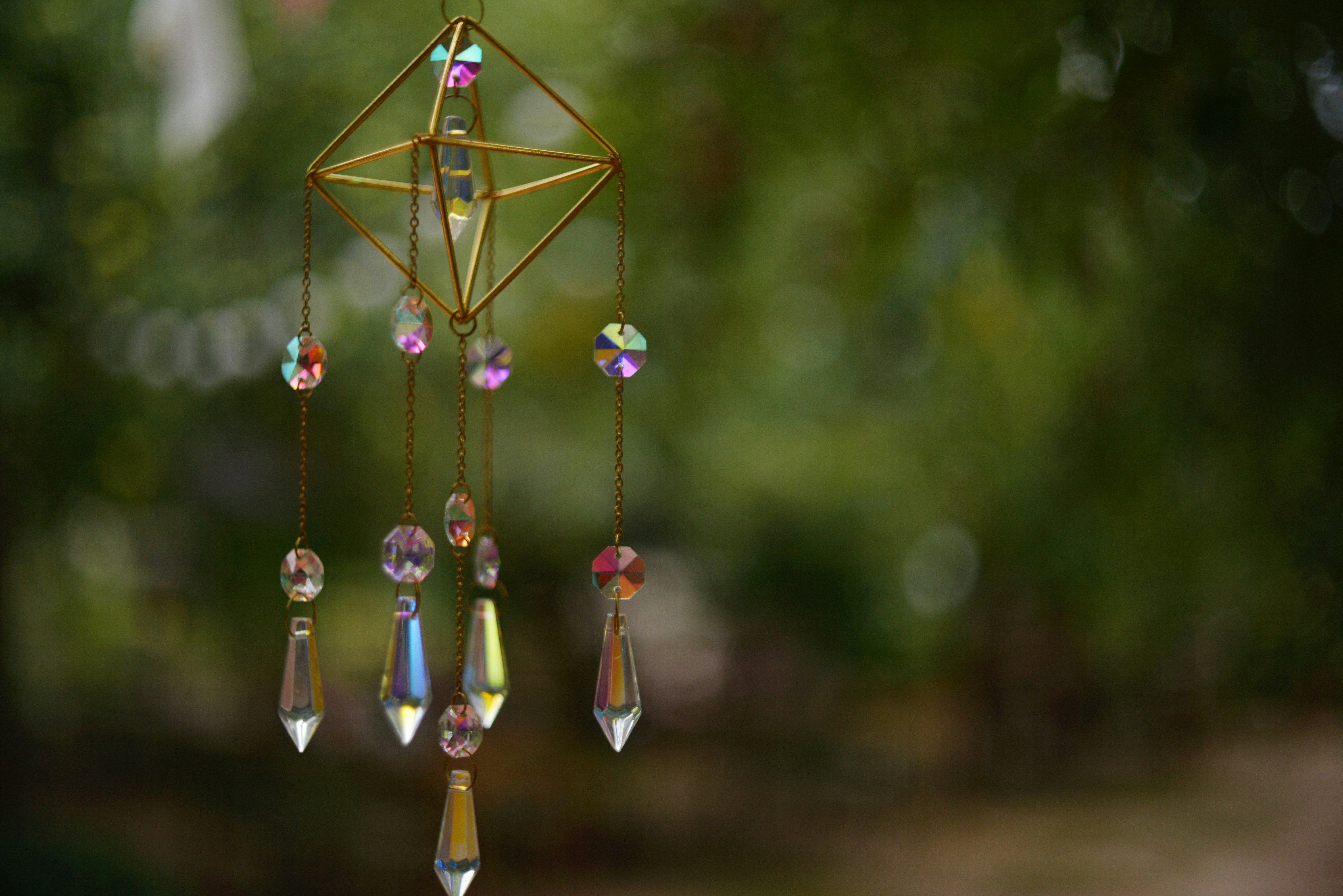 Crystal Prism Dancer: A Hanging Ornament in Soft Sunlight
