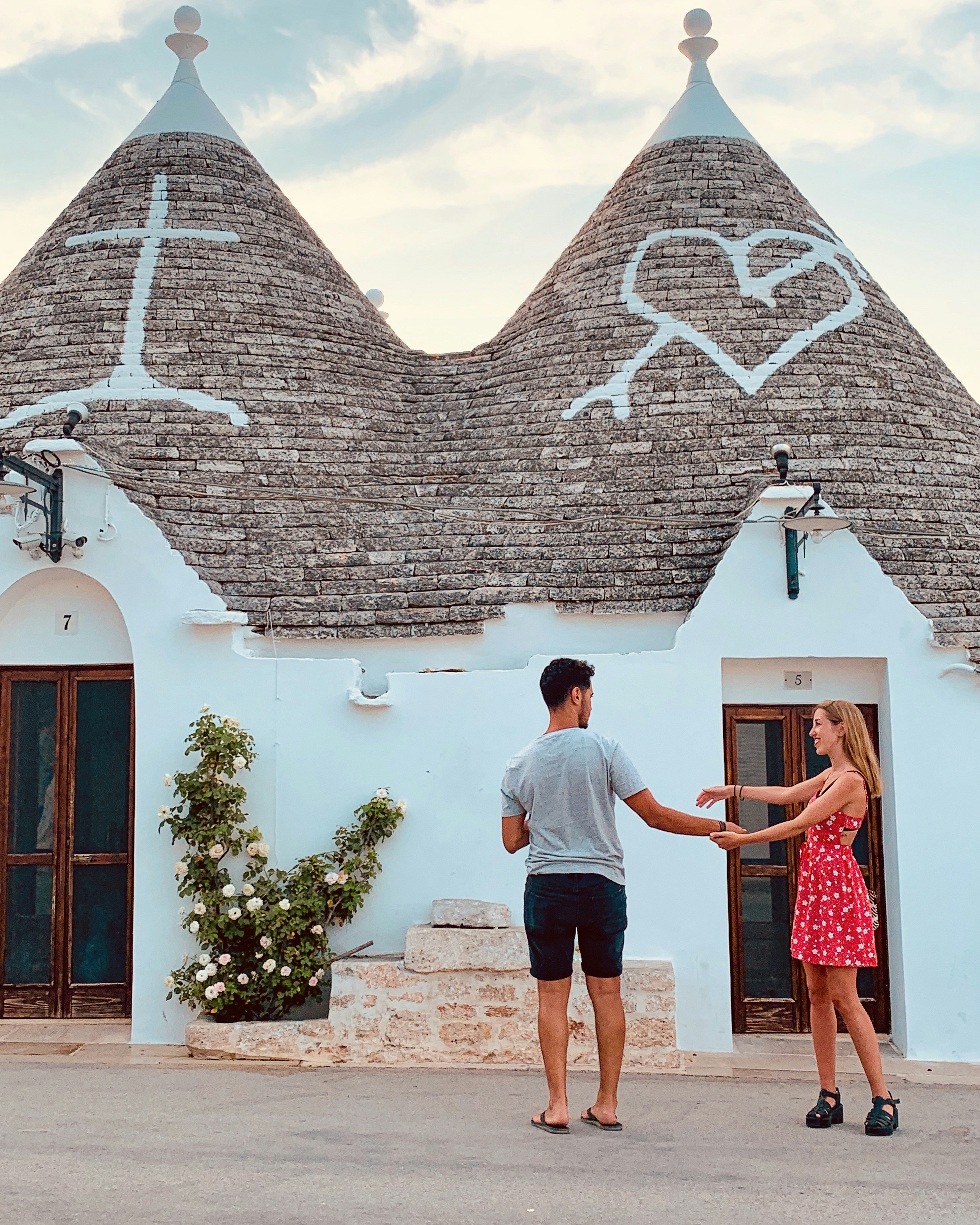 Handshake on a Blue-Coated Terrace: A Moment at the Roofline Hearts