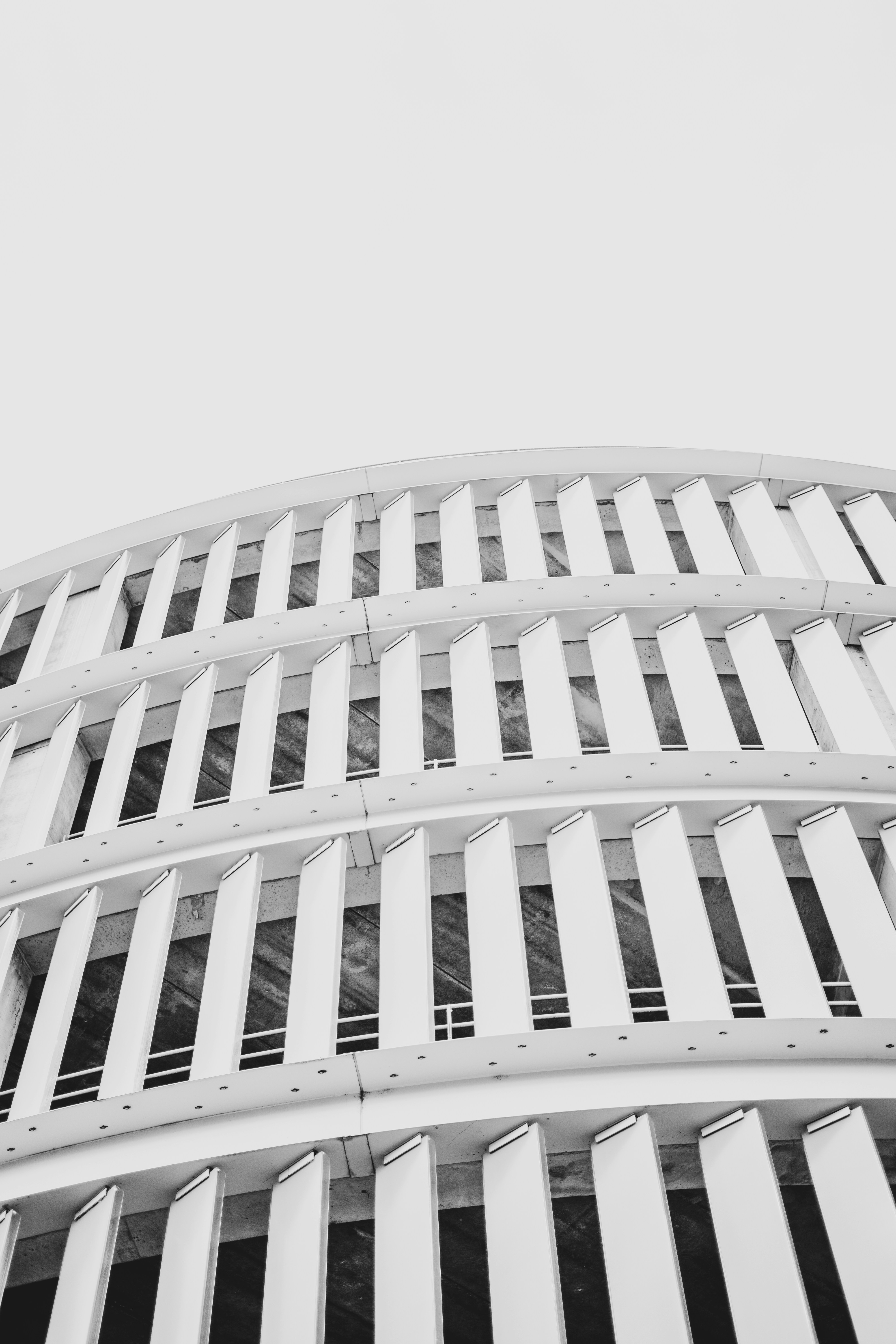 Curved Slats in Monochrome: A Sculptural Play of Light and Shadow
