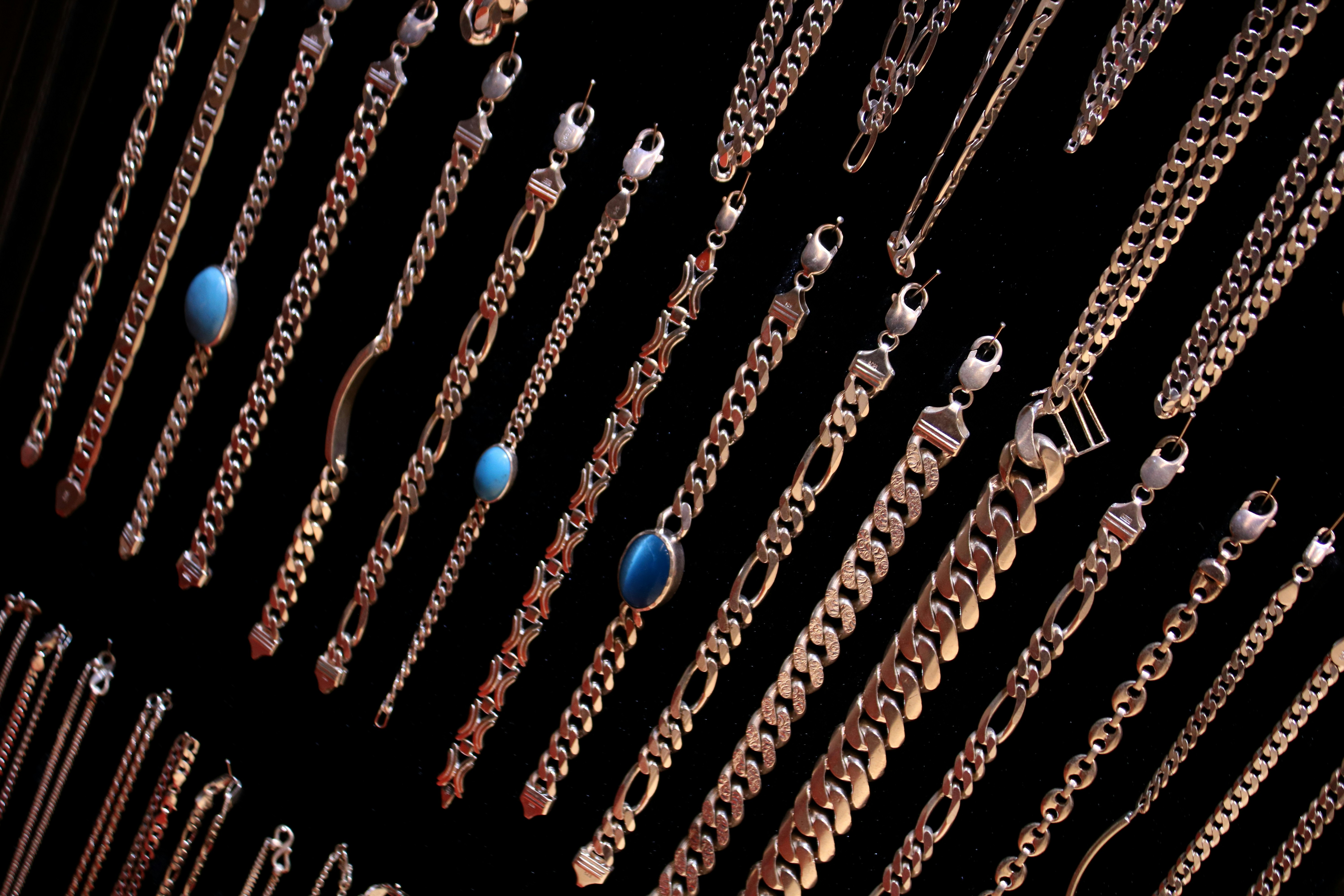 Gleaming chains in a dark showroom