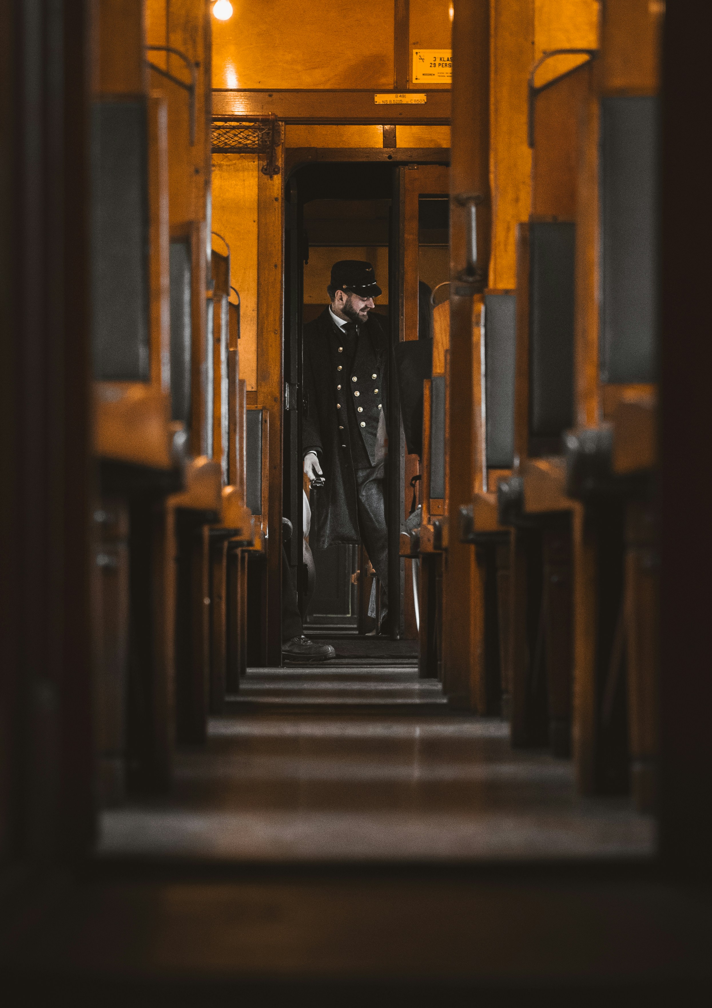 Midnight Conductor: A Silent Gaze Through the Carriage Aisle