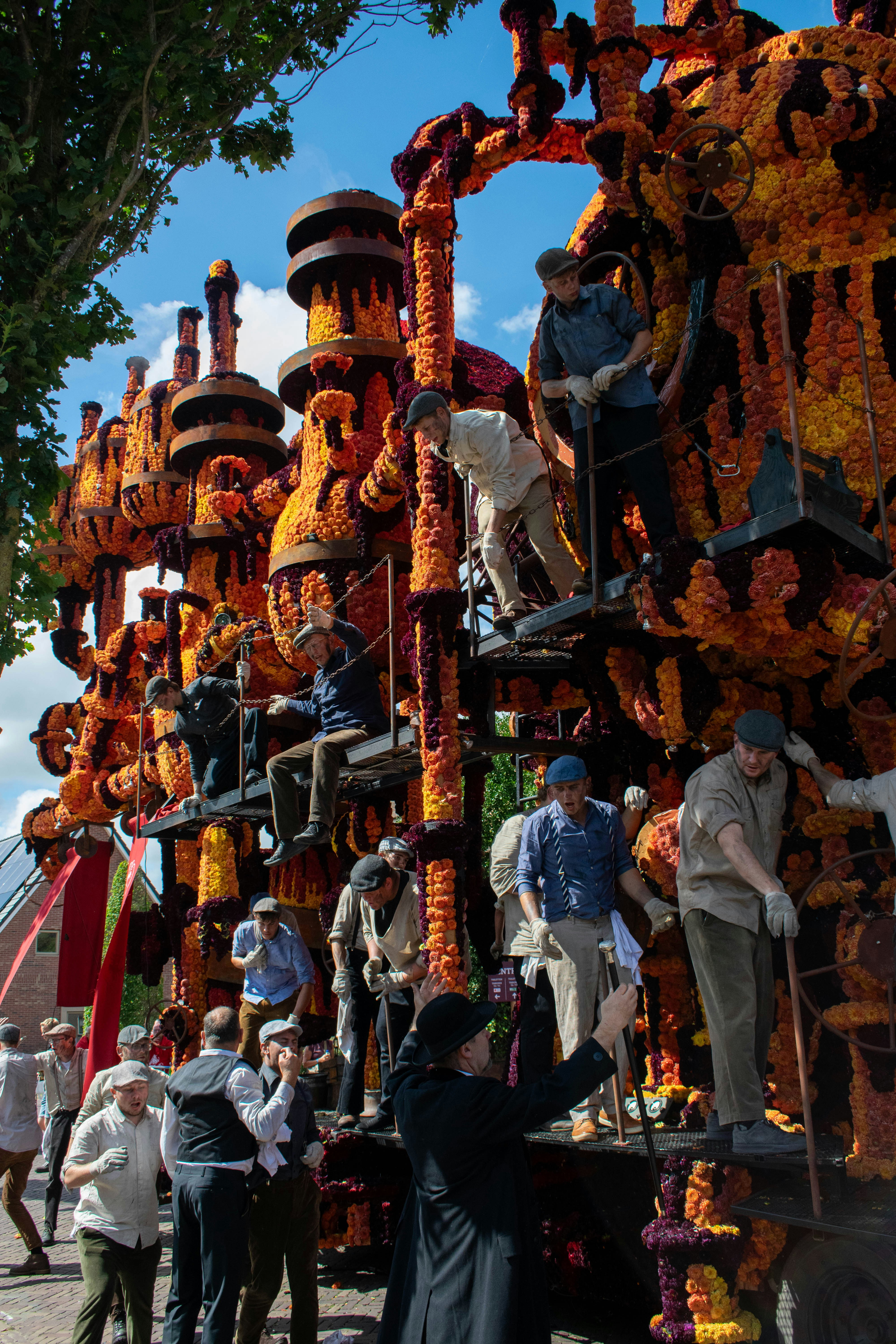 Floral Colossus: Workers in Blooming Carriage Train