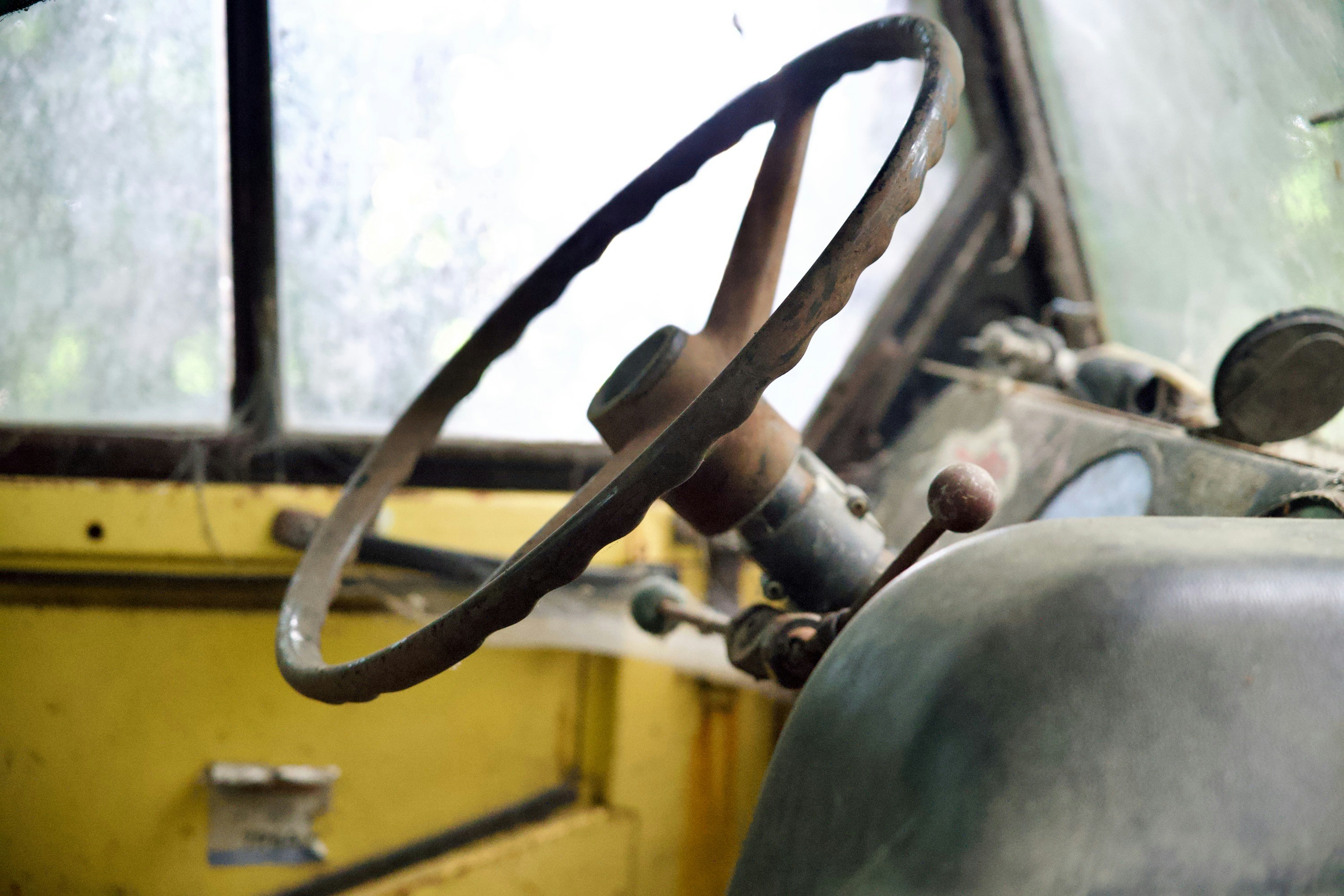 Dusty Steering Wheel in a Deserted Cab