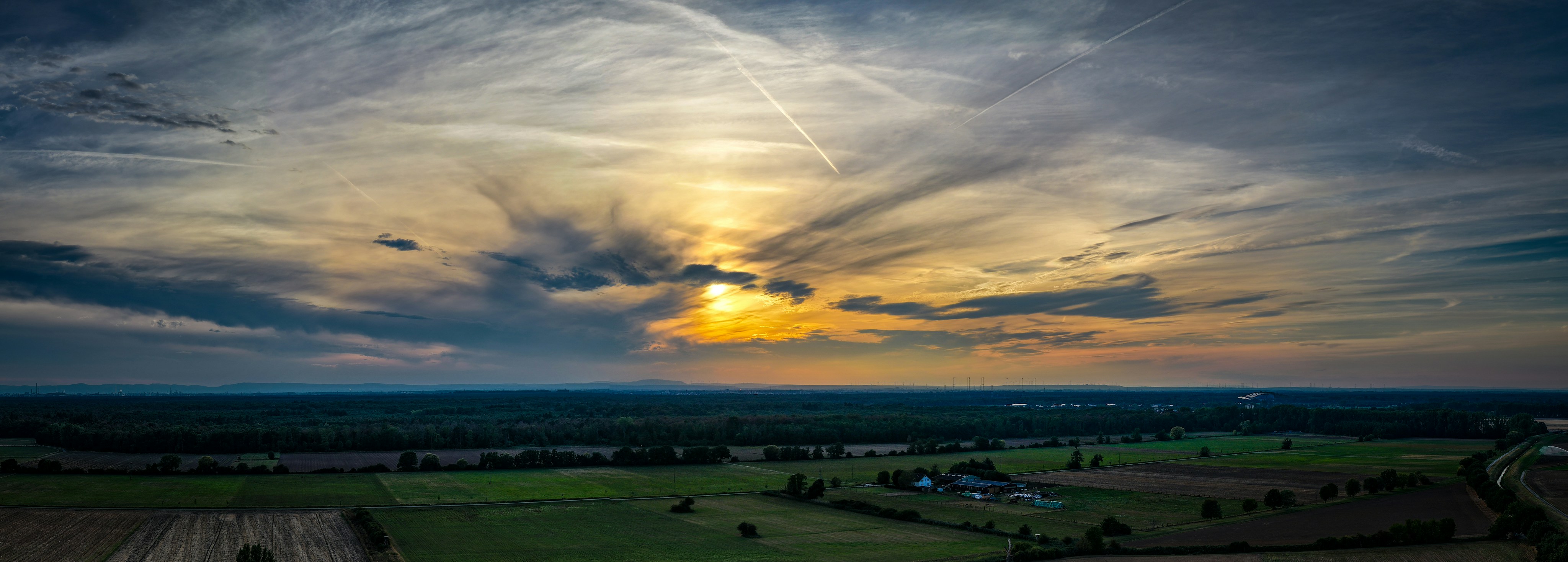 Sunlit Horizon over Quiet Farmlands