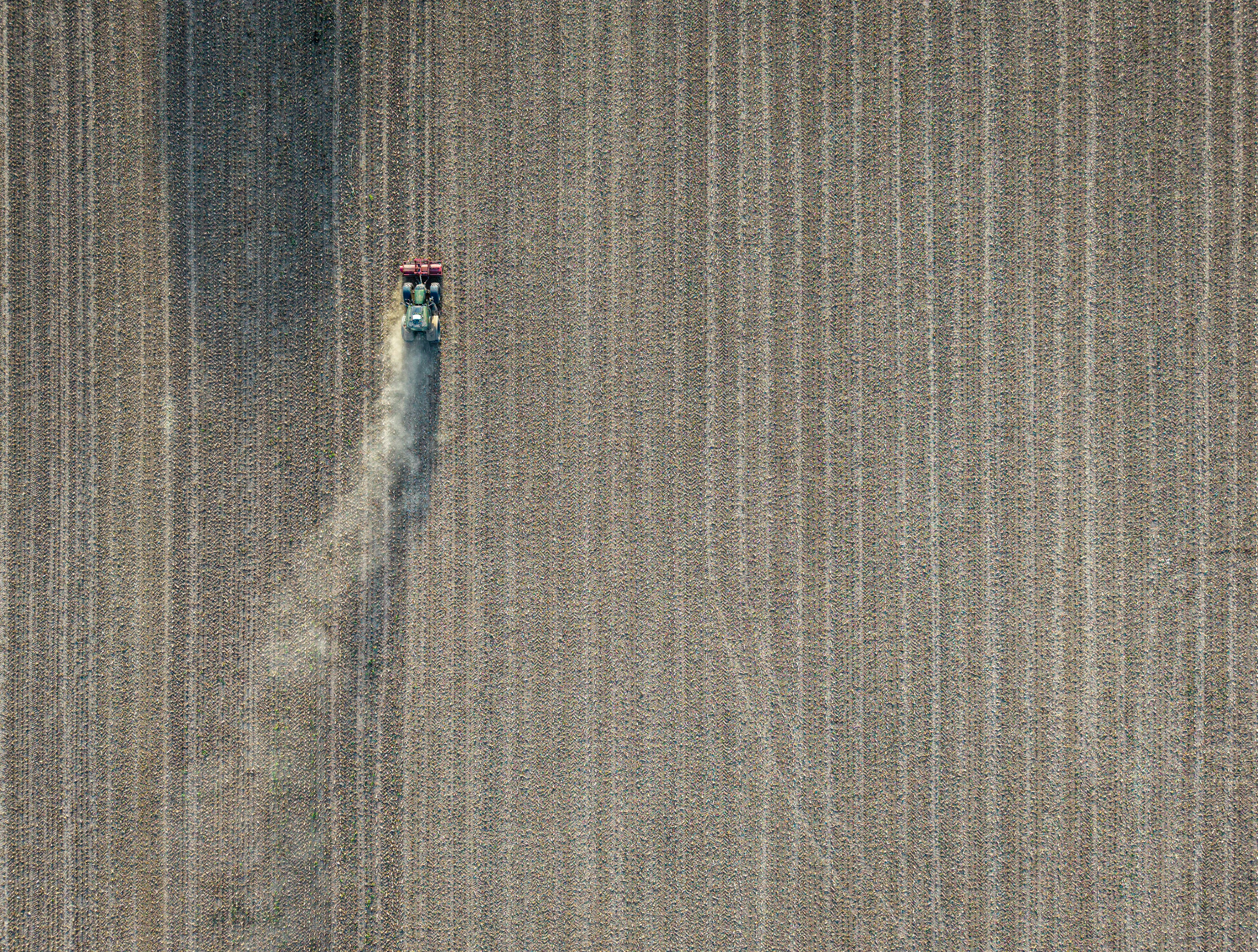 Dust Trail: Aerial Tug of War Across Parched Fields