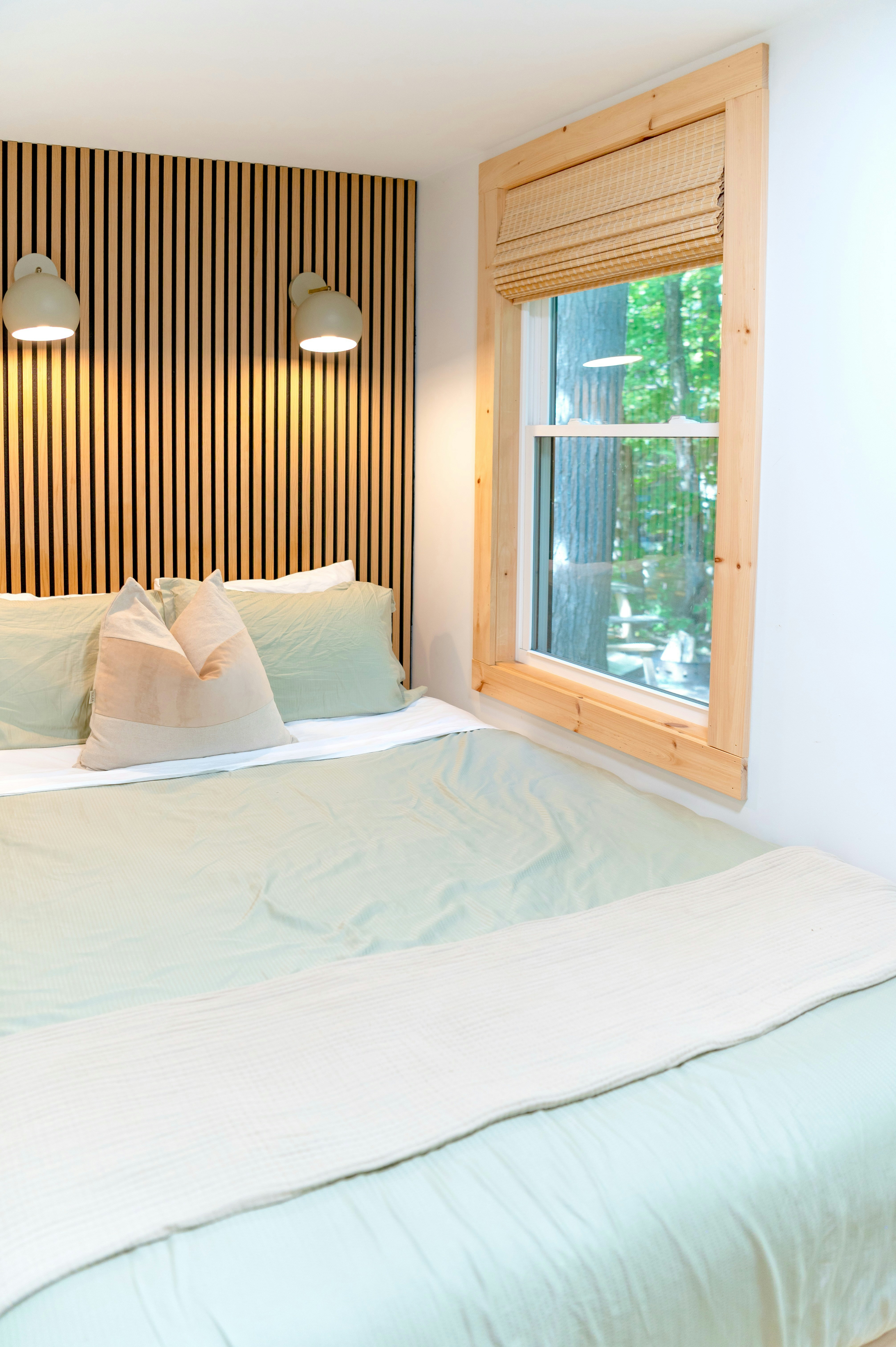 Cozy Corner: Soft Bedding and Natural Window Light in a Minimal Bedroom