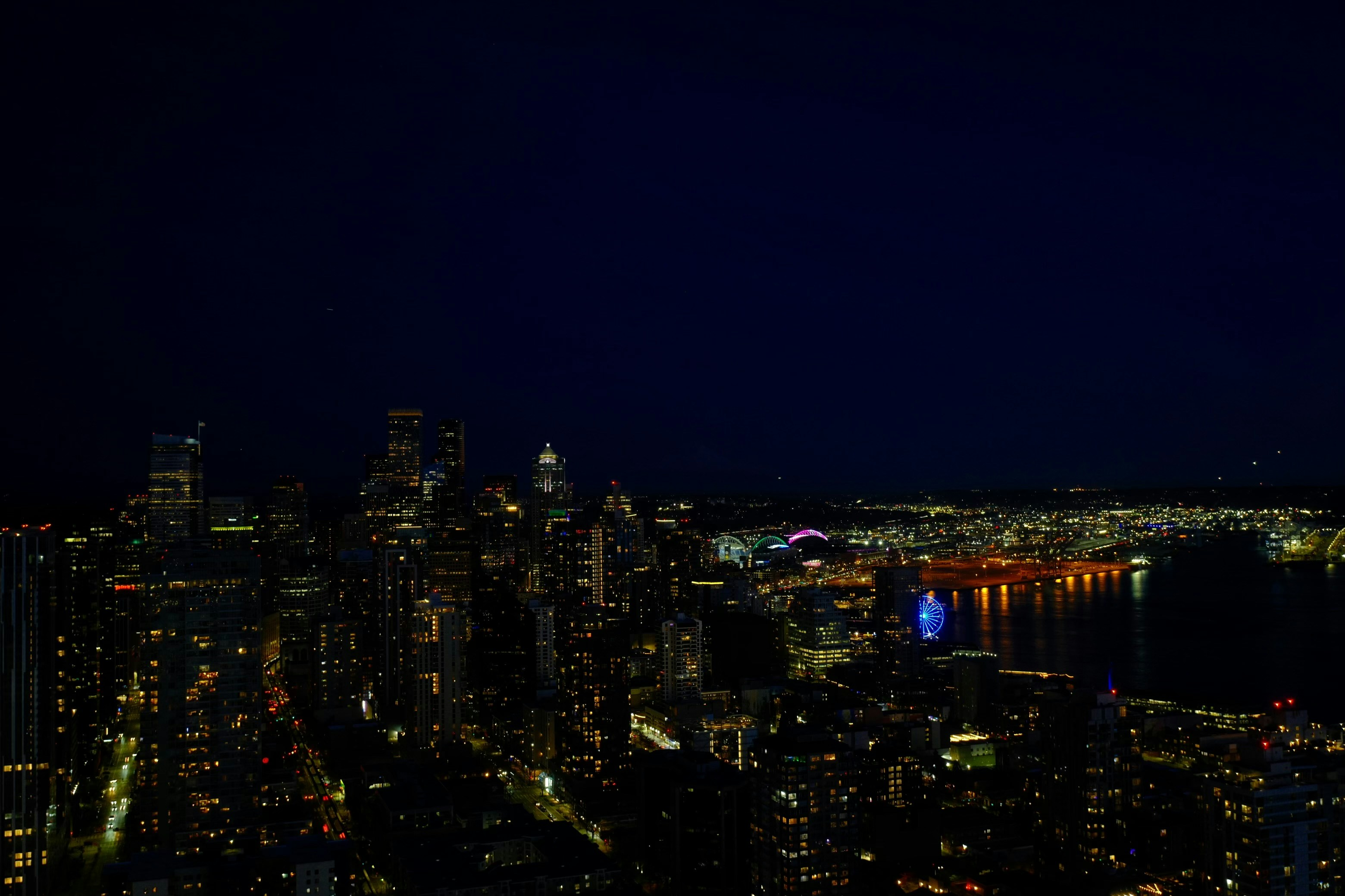 Midnight Skyline: A Quiet Clarity Over the Distant Harbor