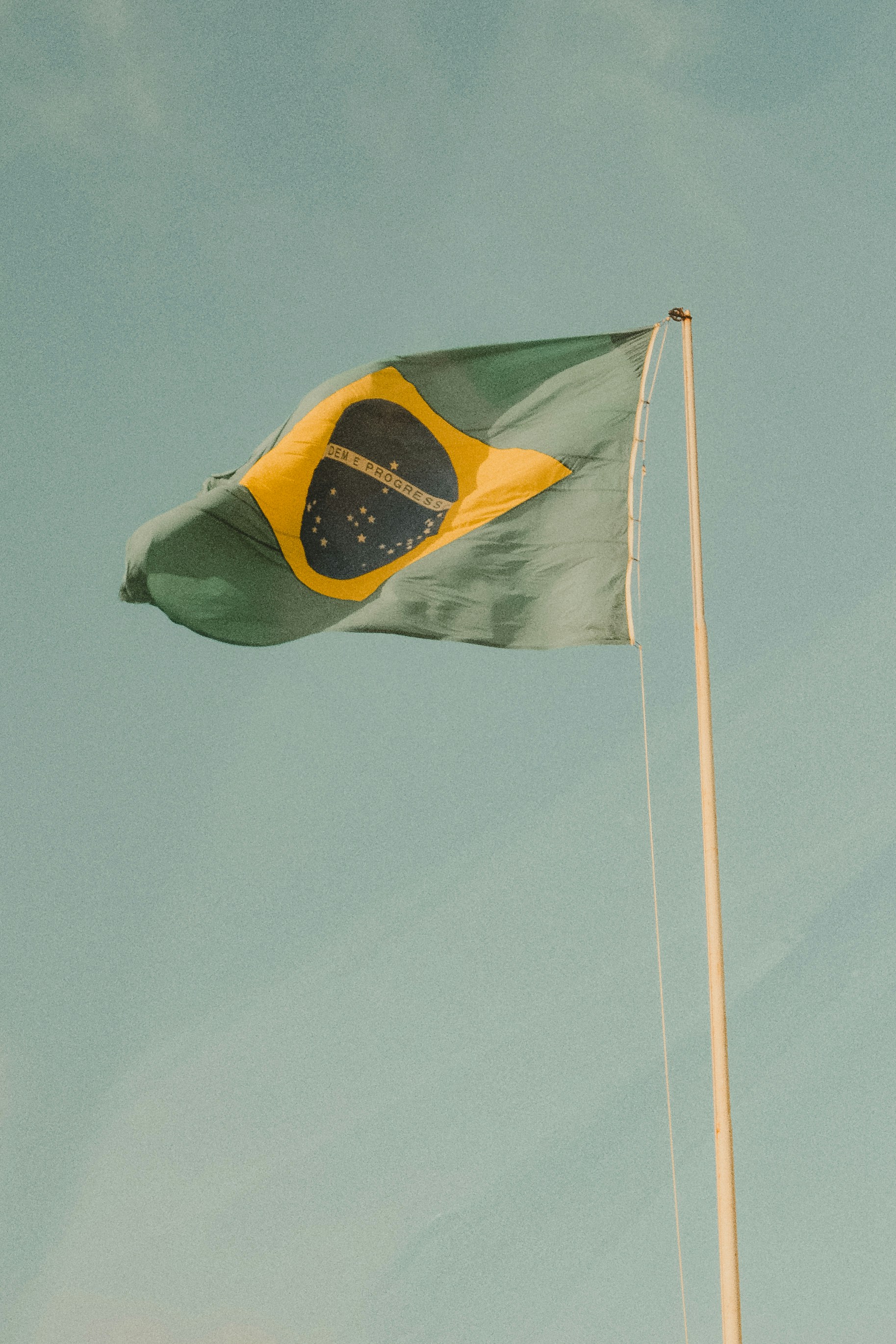 Flag of Brazil Basking in a Soft Prairie Sky