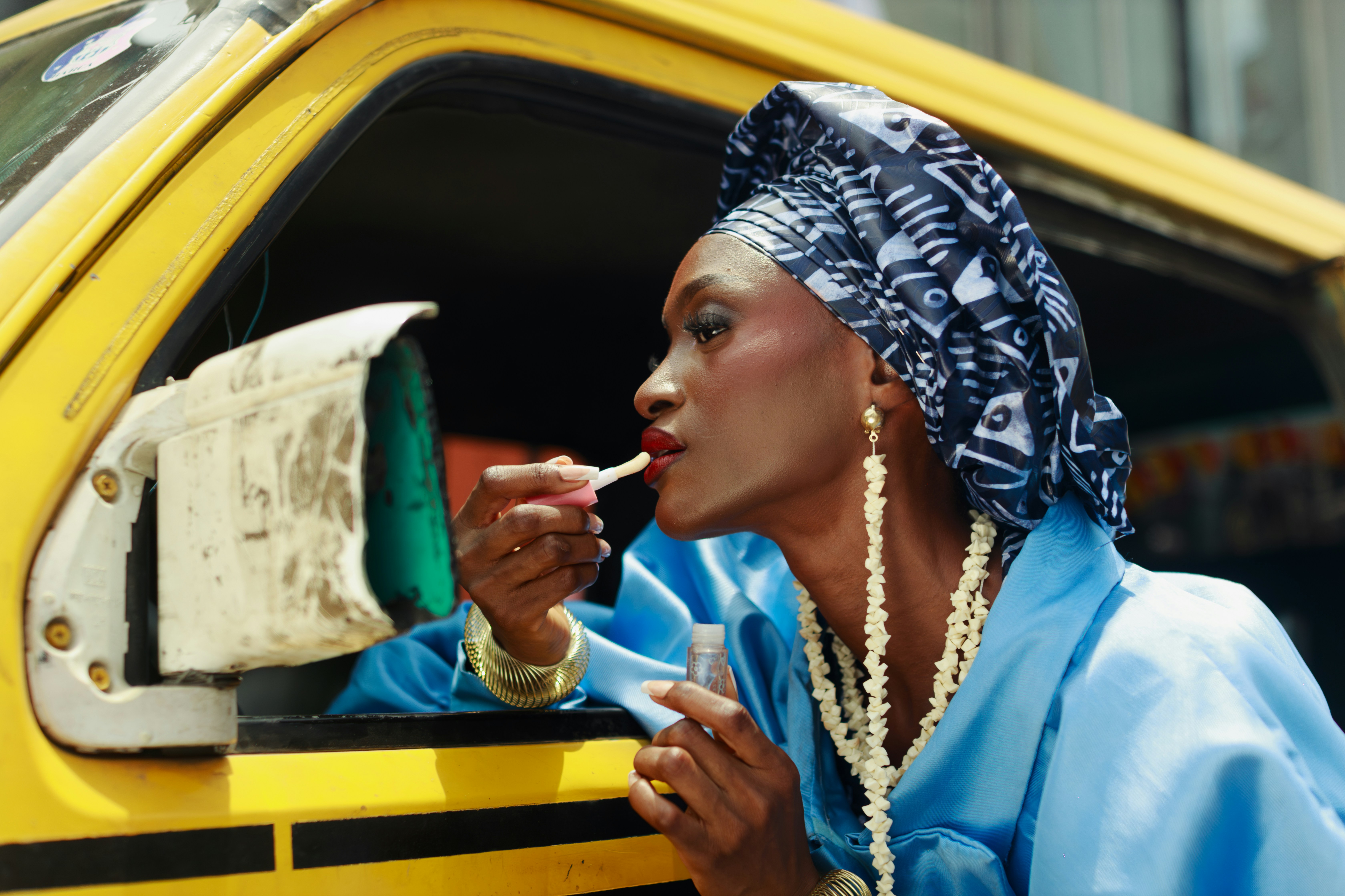 Lipstick and Bright Blue: Ethioptic Moment by the Taxi Window