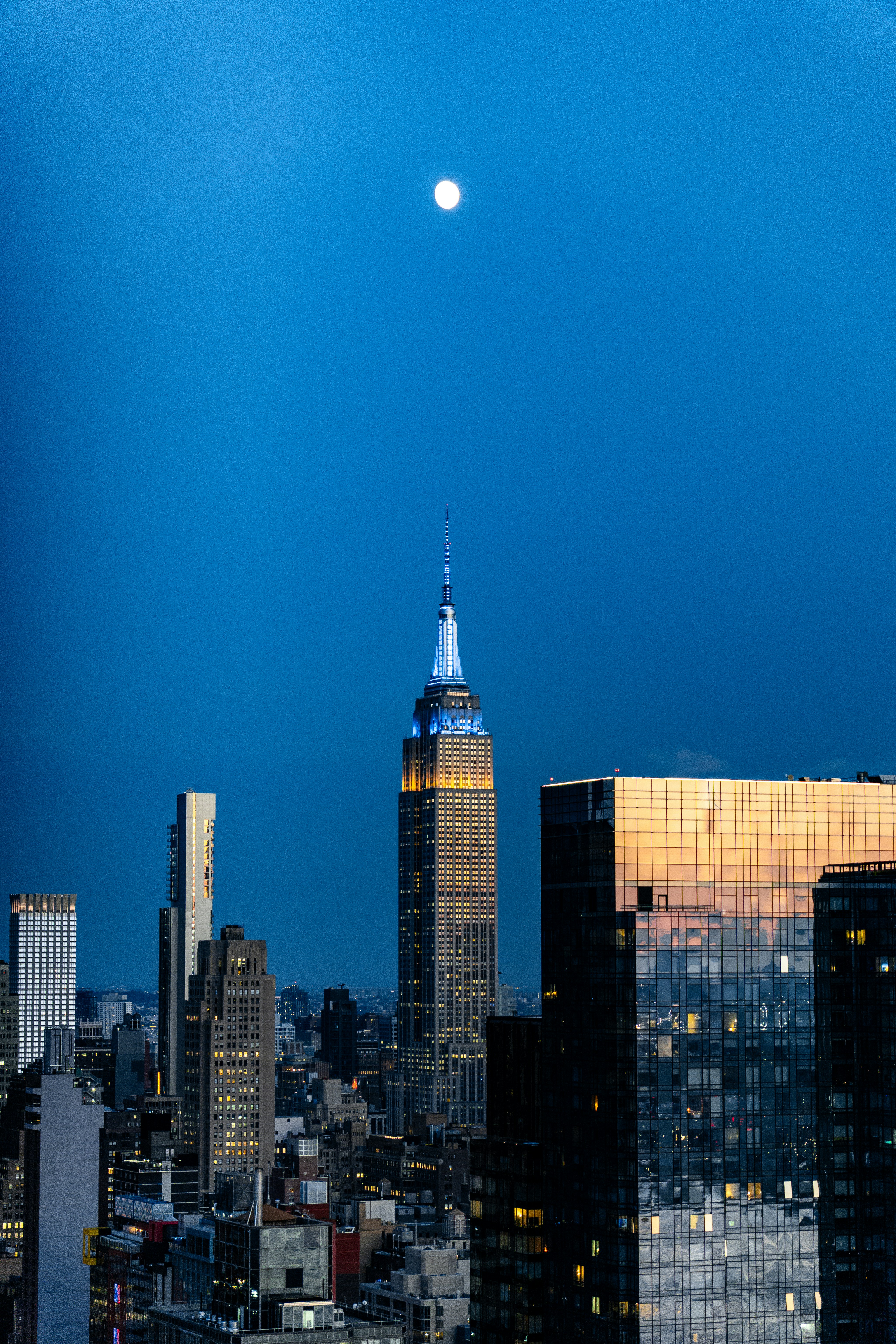 Moonlit Spire: Empire State Silhouette Under a Pale Night