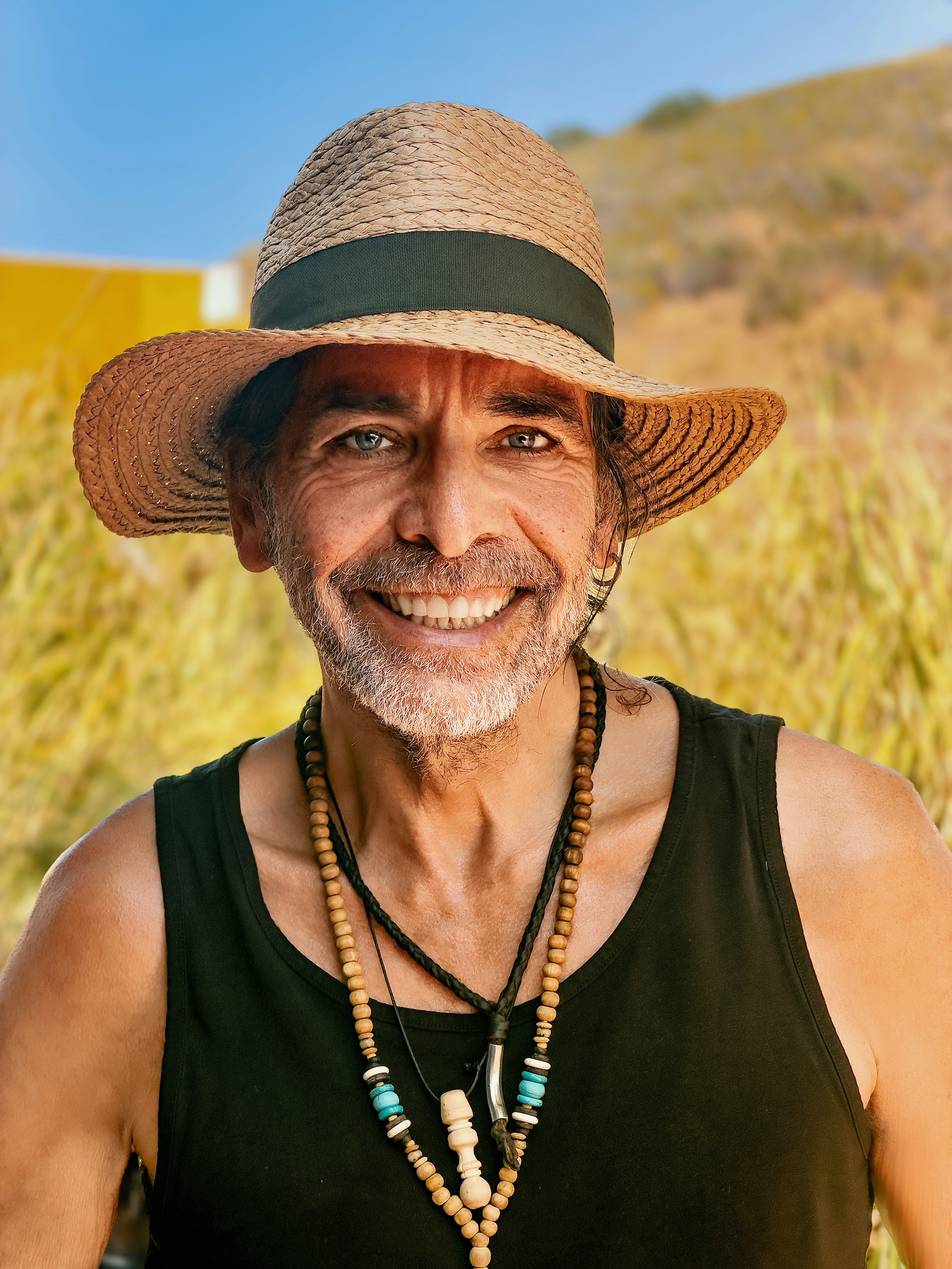 Sunlit Gaze: A Weathered Joy in the Wheat Field