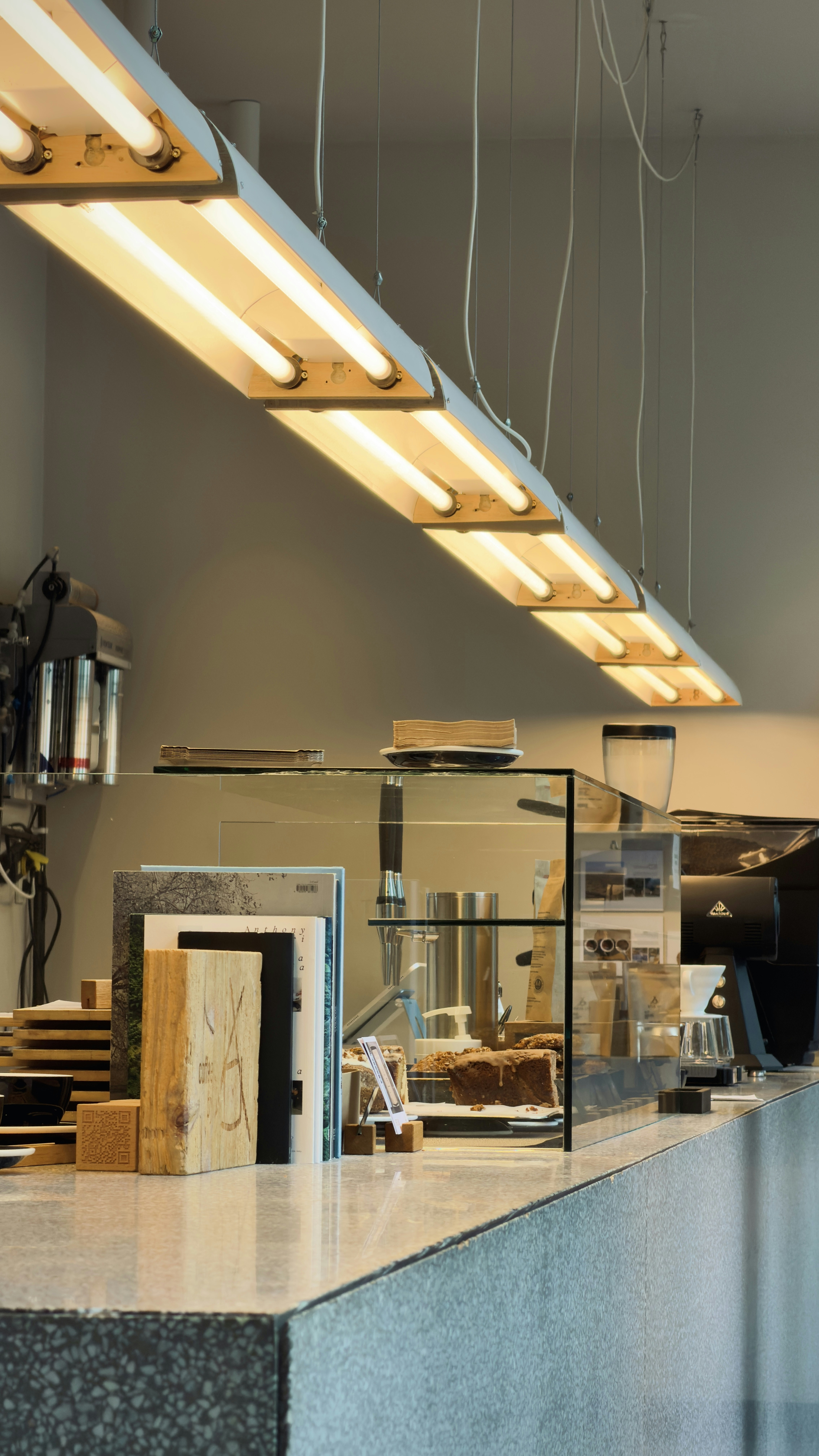 Minimalist Café Showcase: Warm Light Over a Glass Counter