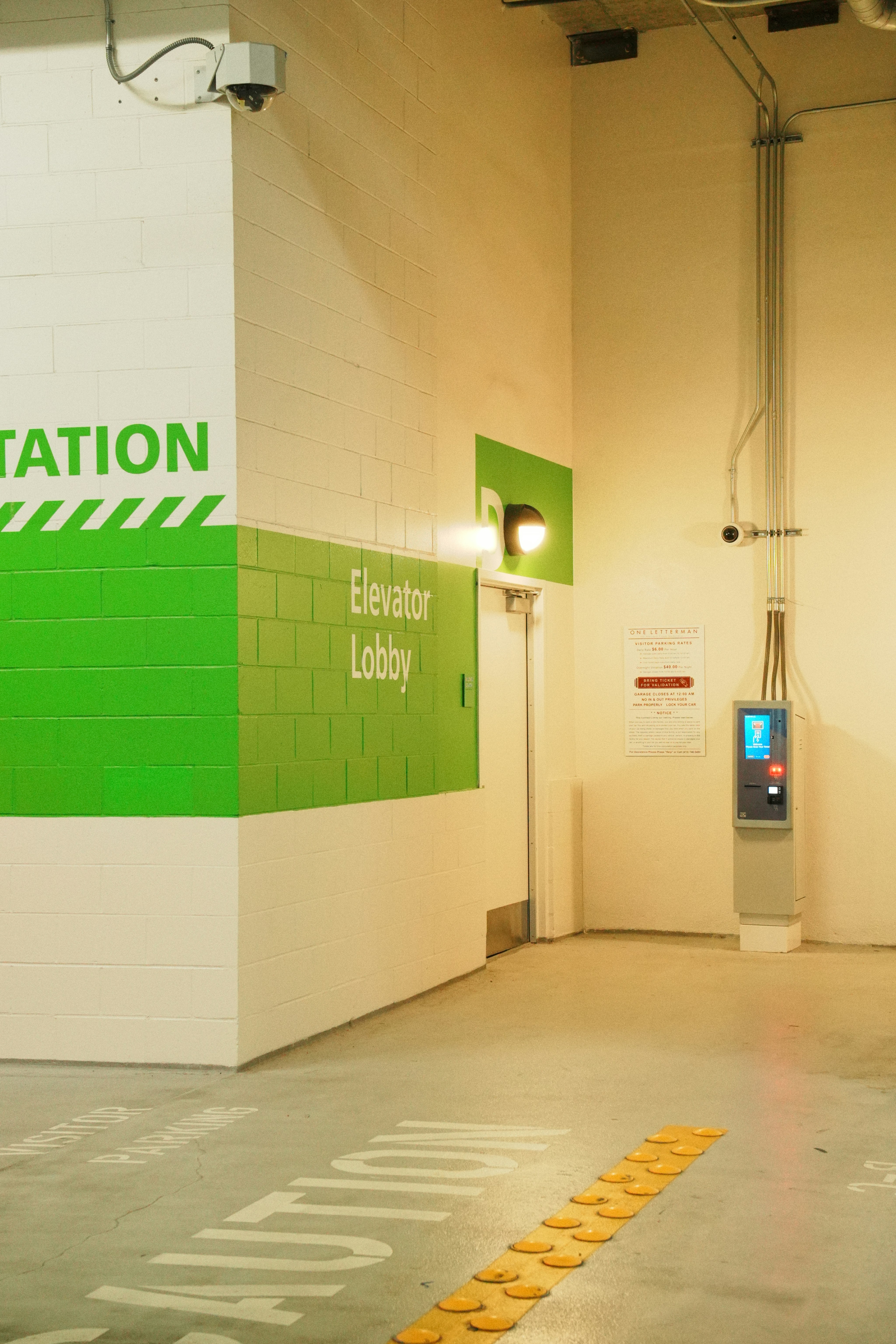 Green Corridor: Elevator Lobby Calm Inside a Transit Hub