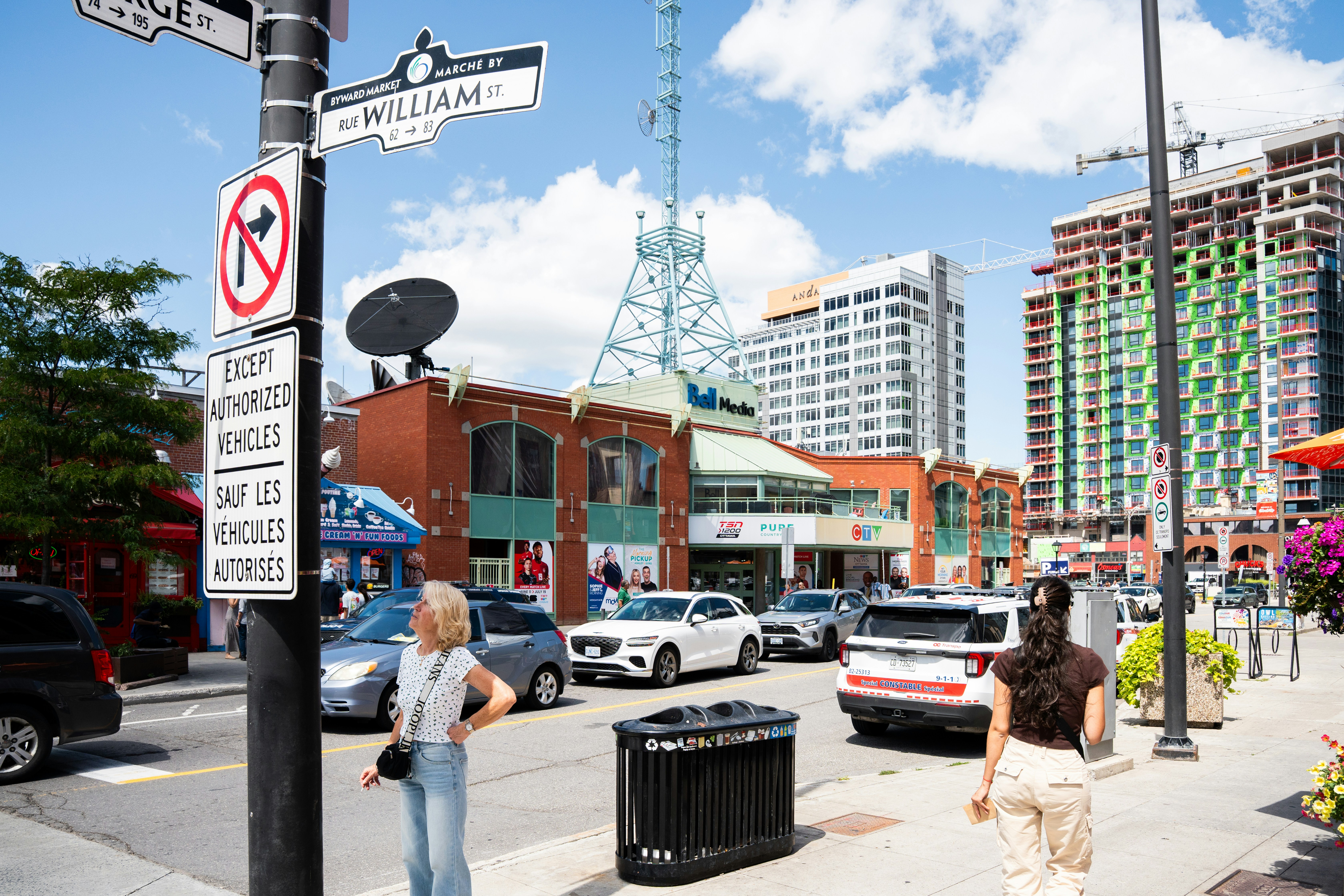 Midday Street Pulse: People, Cars and City Life at a Busy Corner