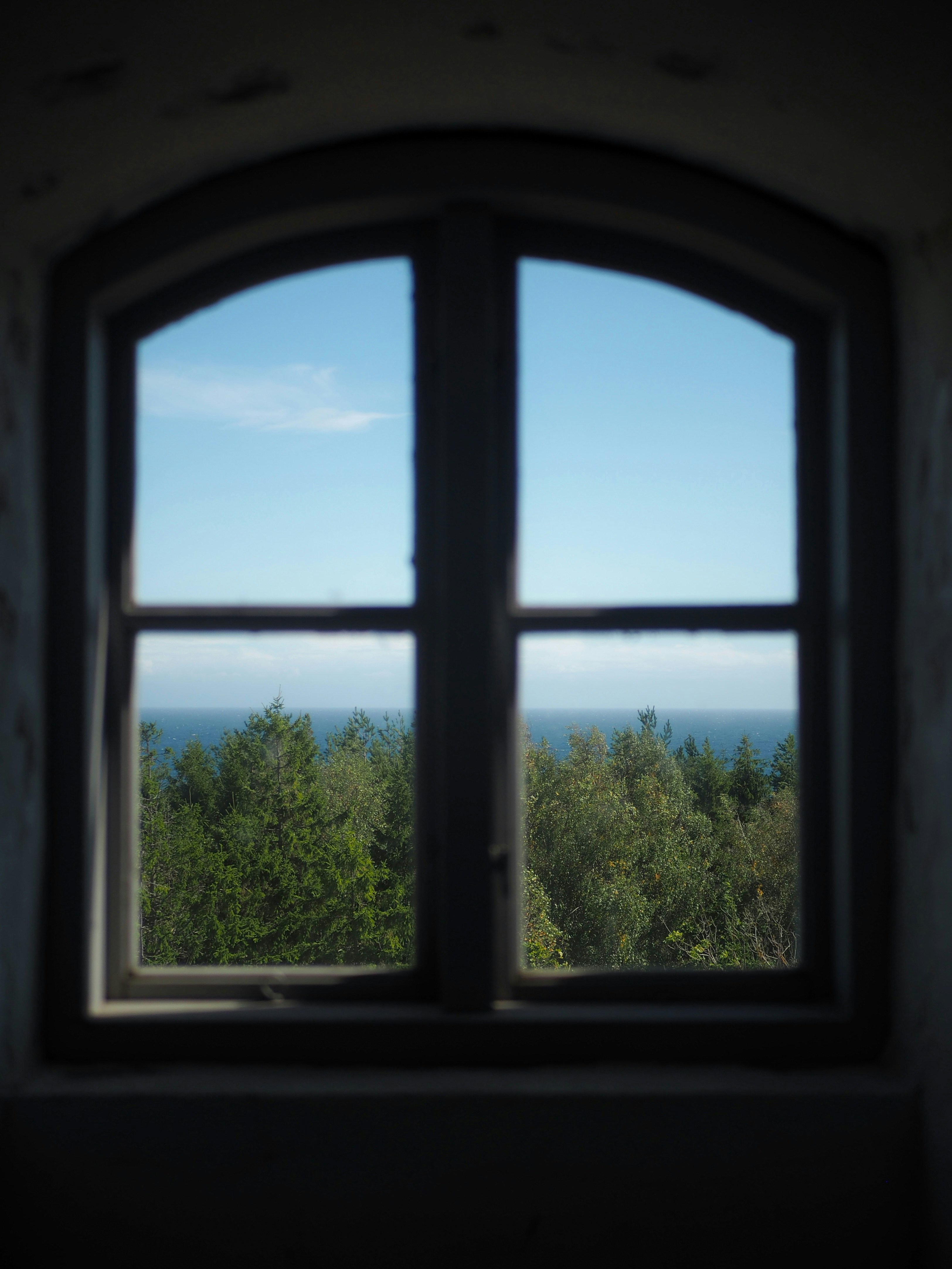A Quiet View Through Stone Frames: Sea and Sky Beyond the Window