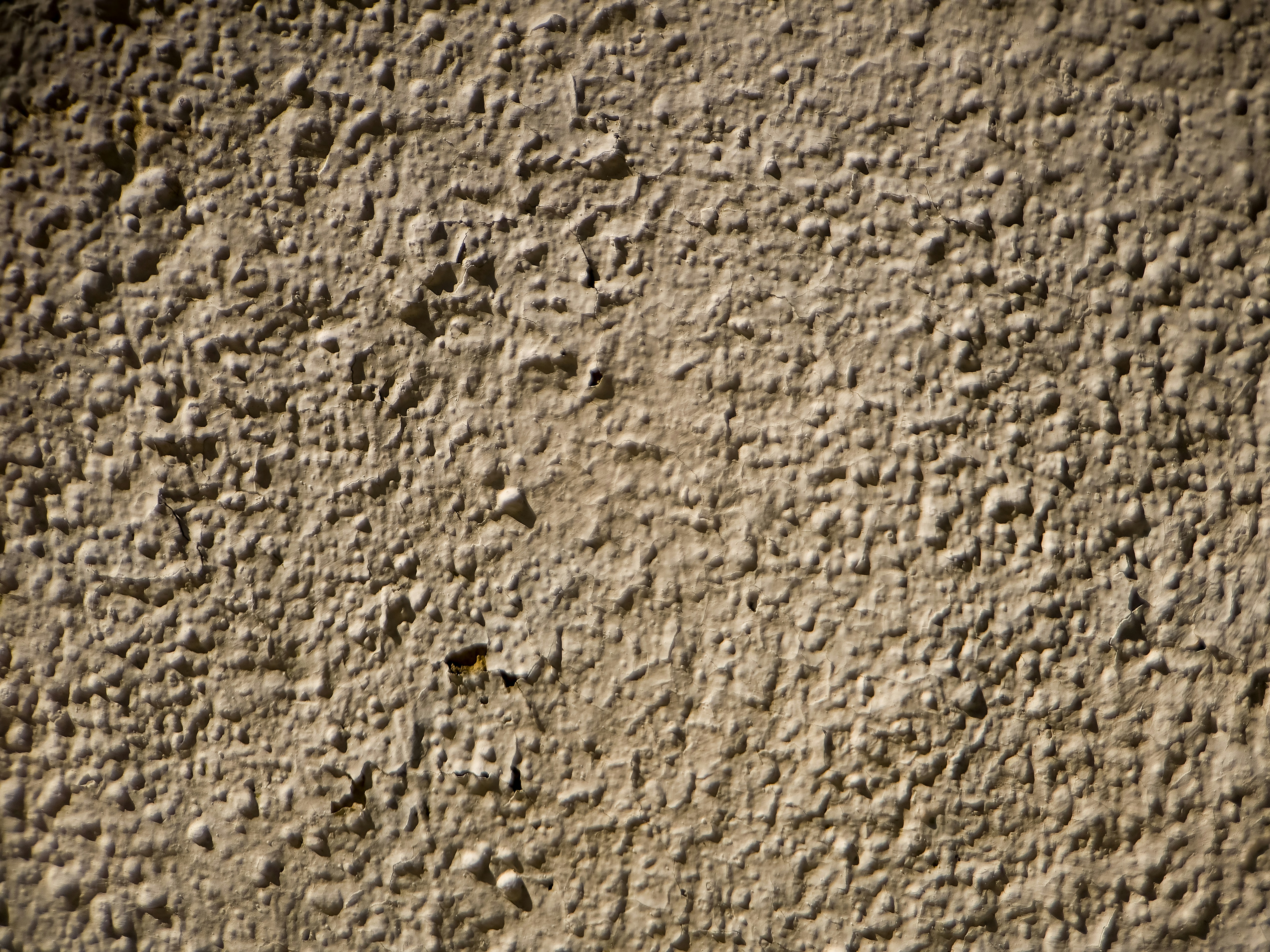 Rugged Texture: Sunlit Pebbles on a Chalky Plain