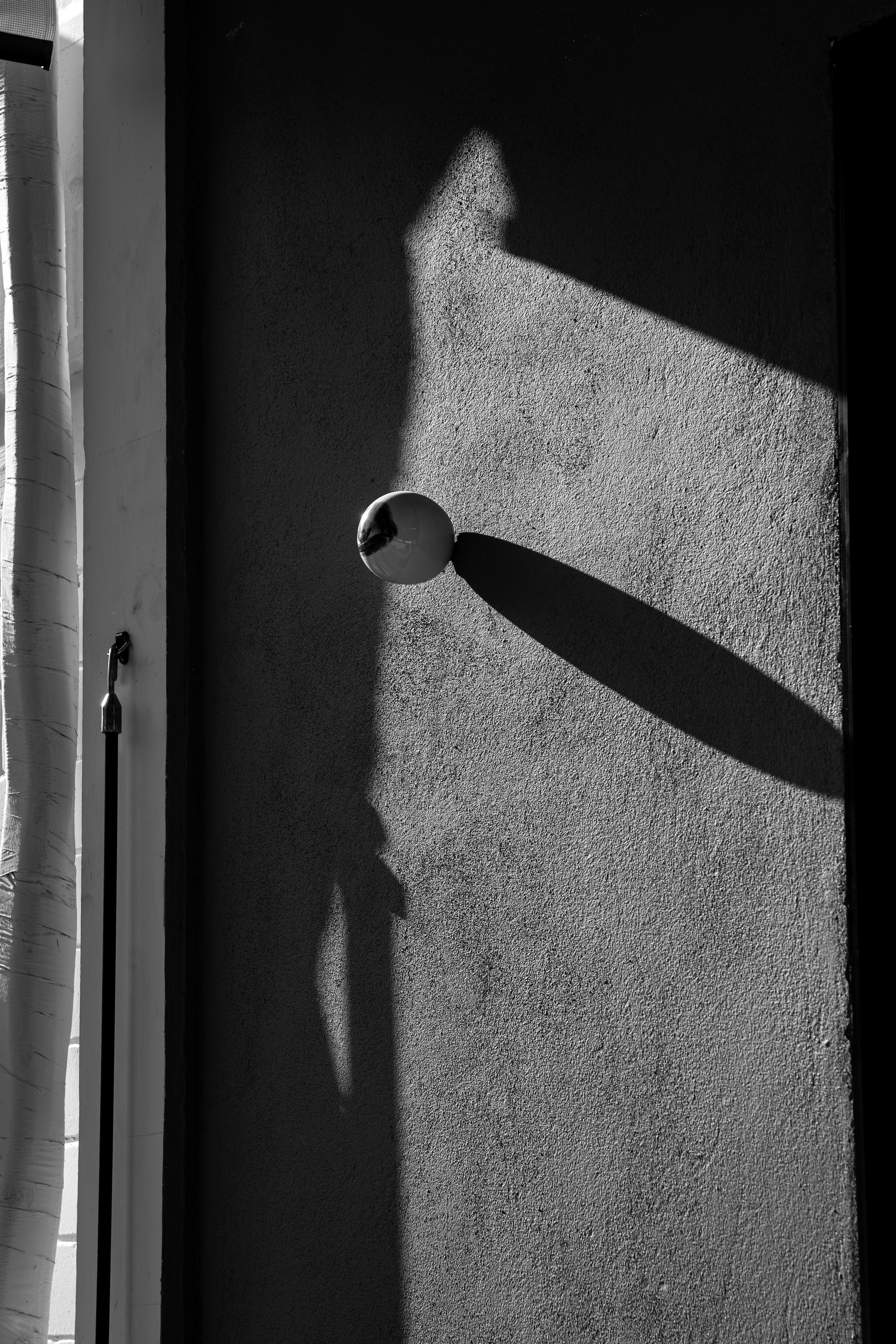 Shadowed Door Knob: An Oblique Study in Light and Form